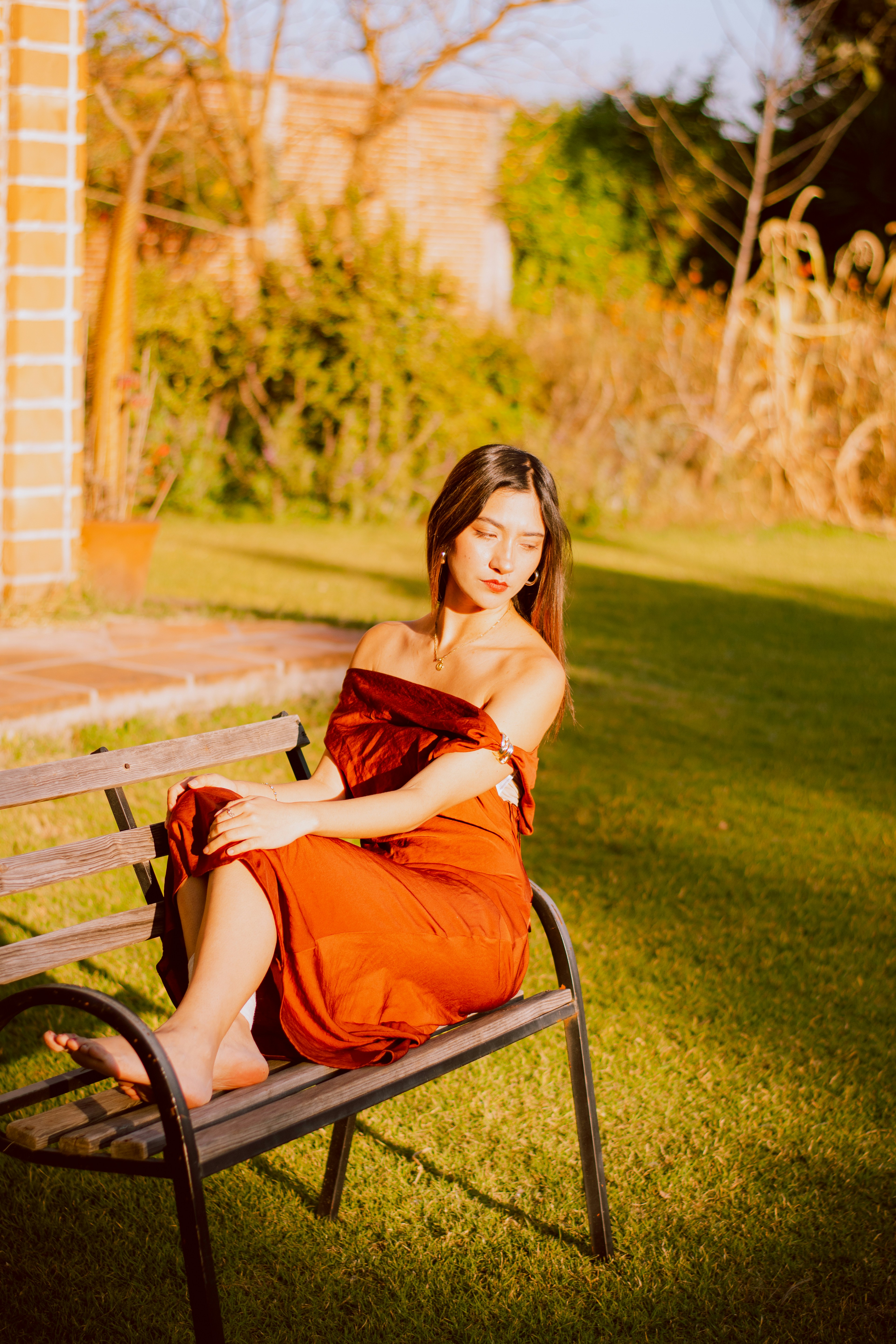 Orange-gown moment on the garden bench