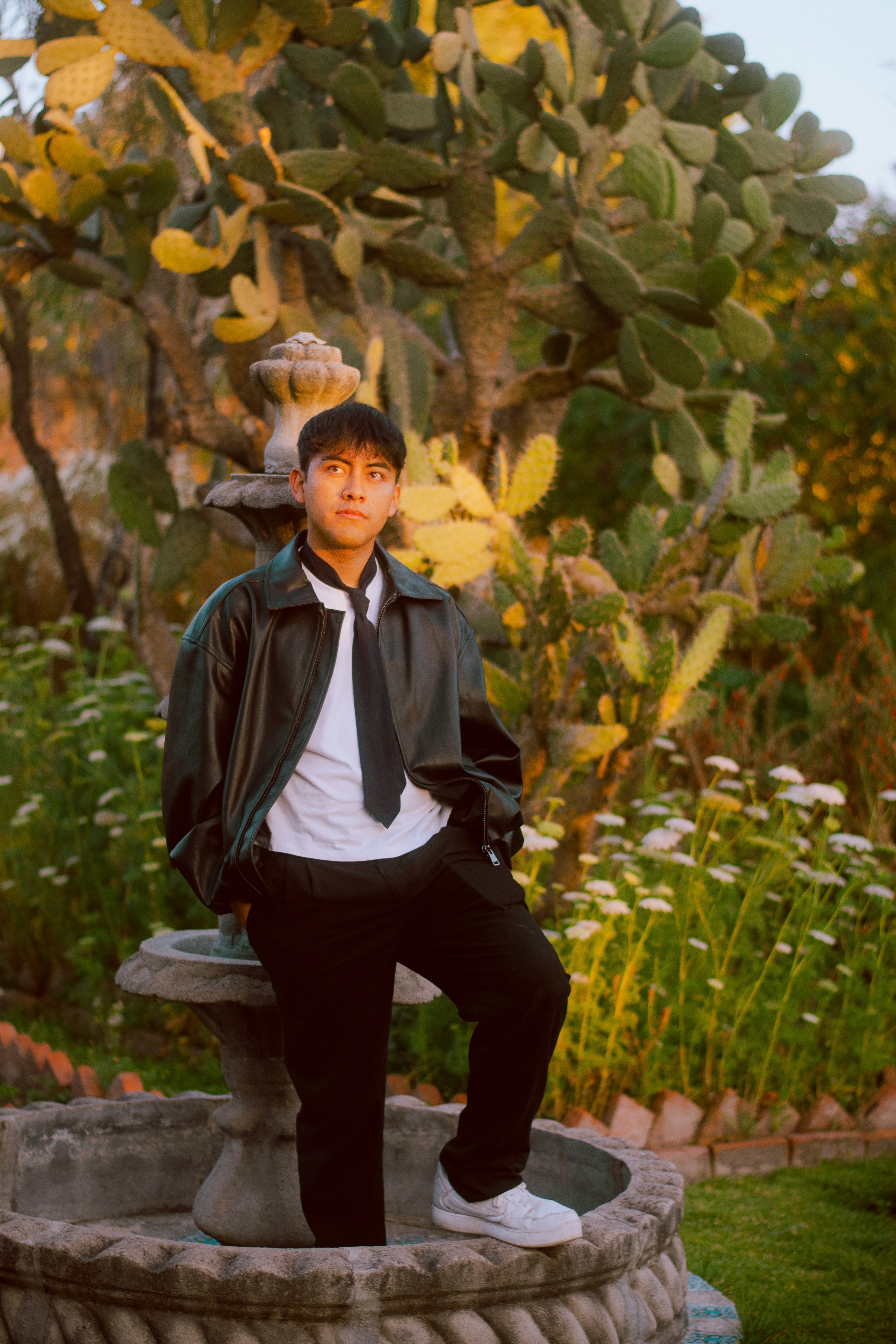 Youthful Stance by the Cactus Fountain