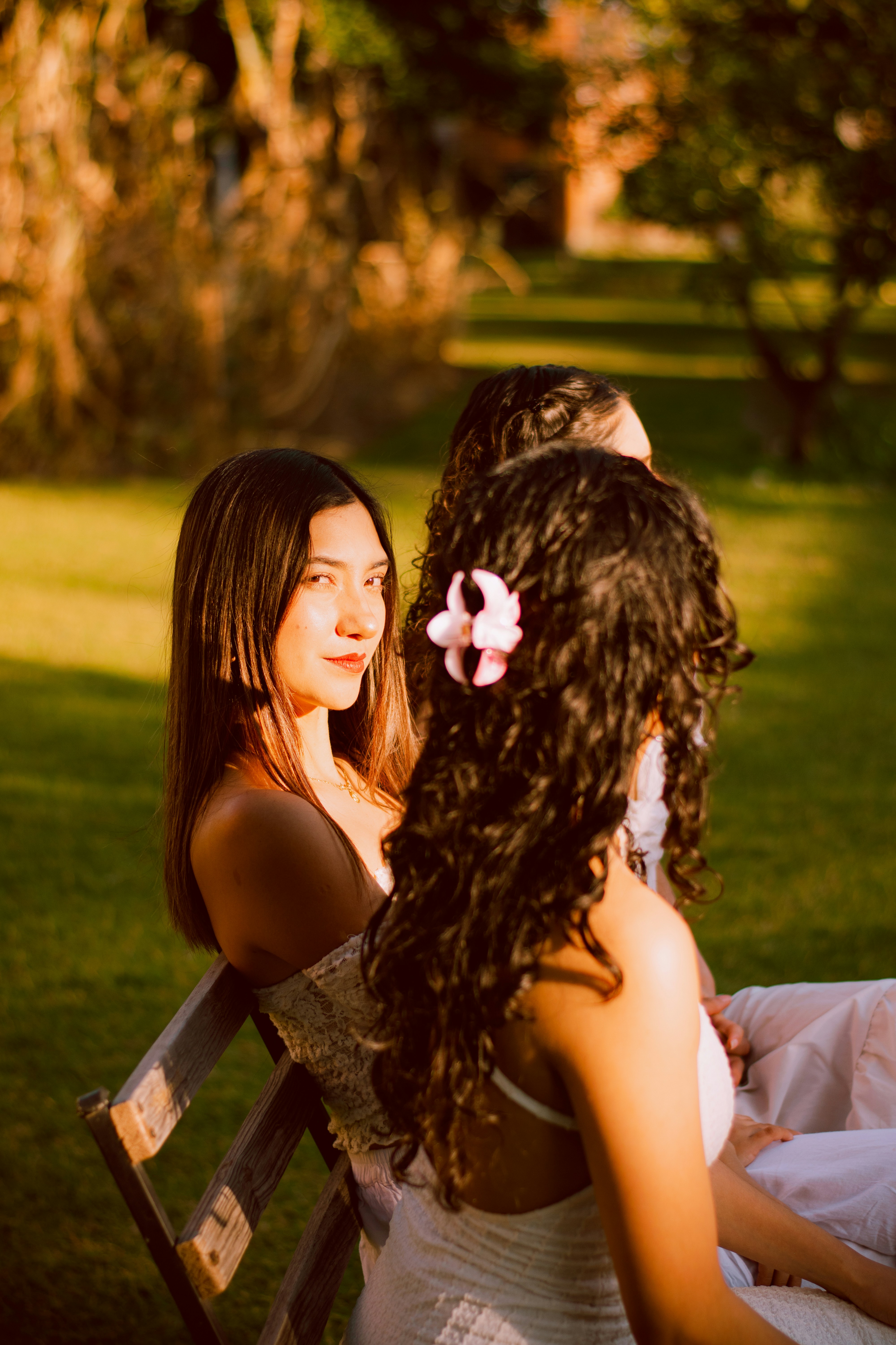 Sunlit Portrait of Friends on a Park Bench