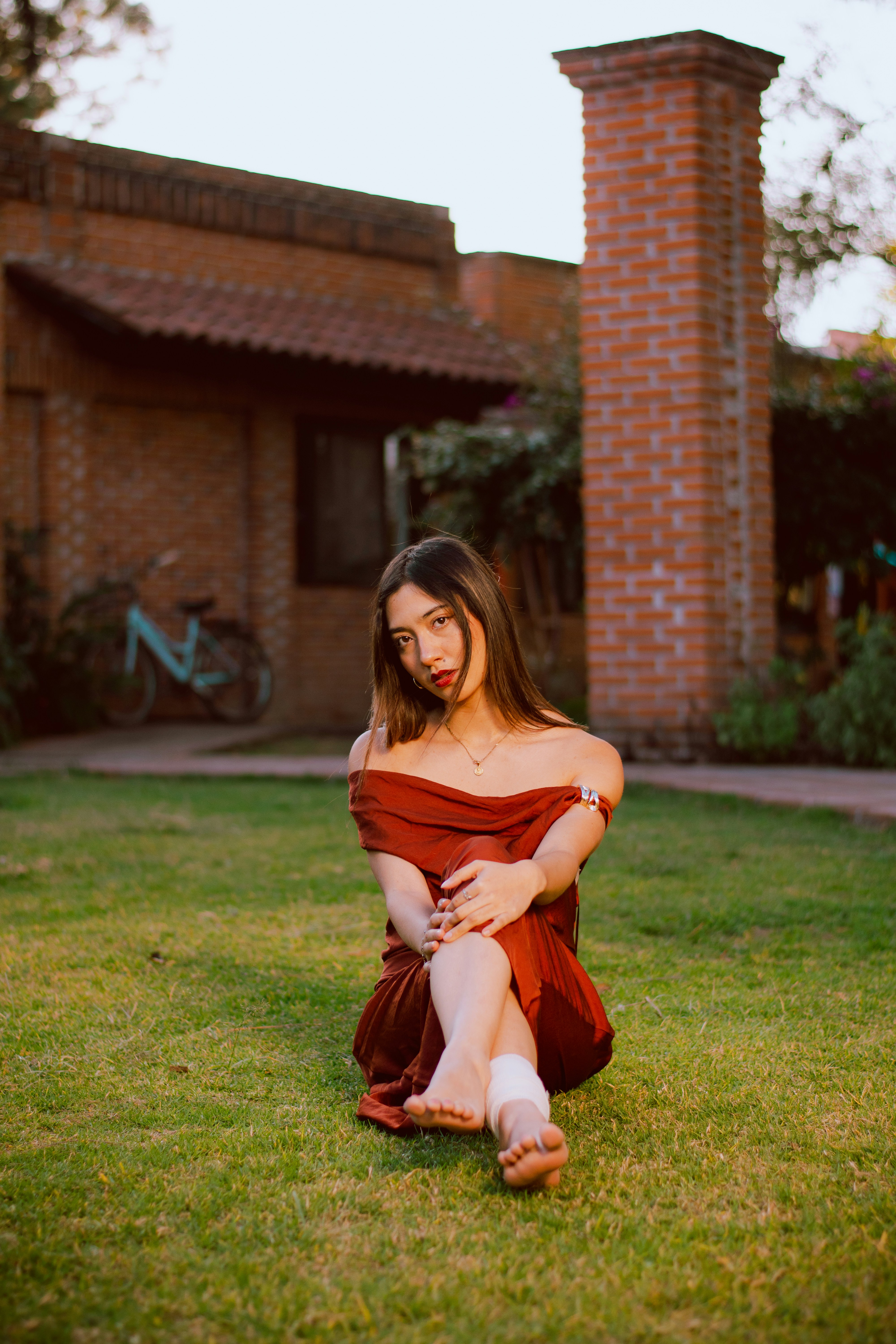 Crimson Shyness: A Red-draped Moment on the Lawn