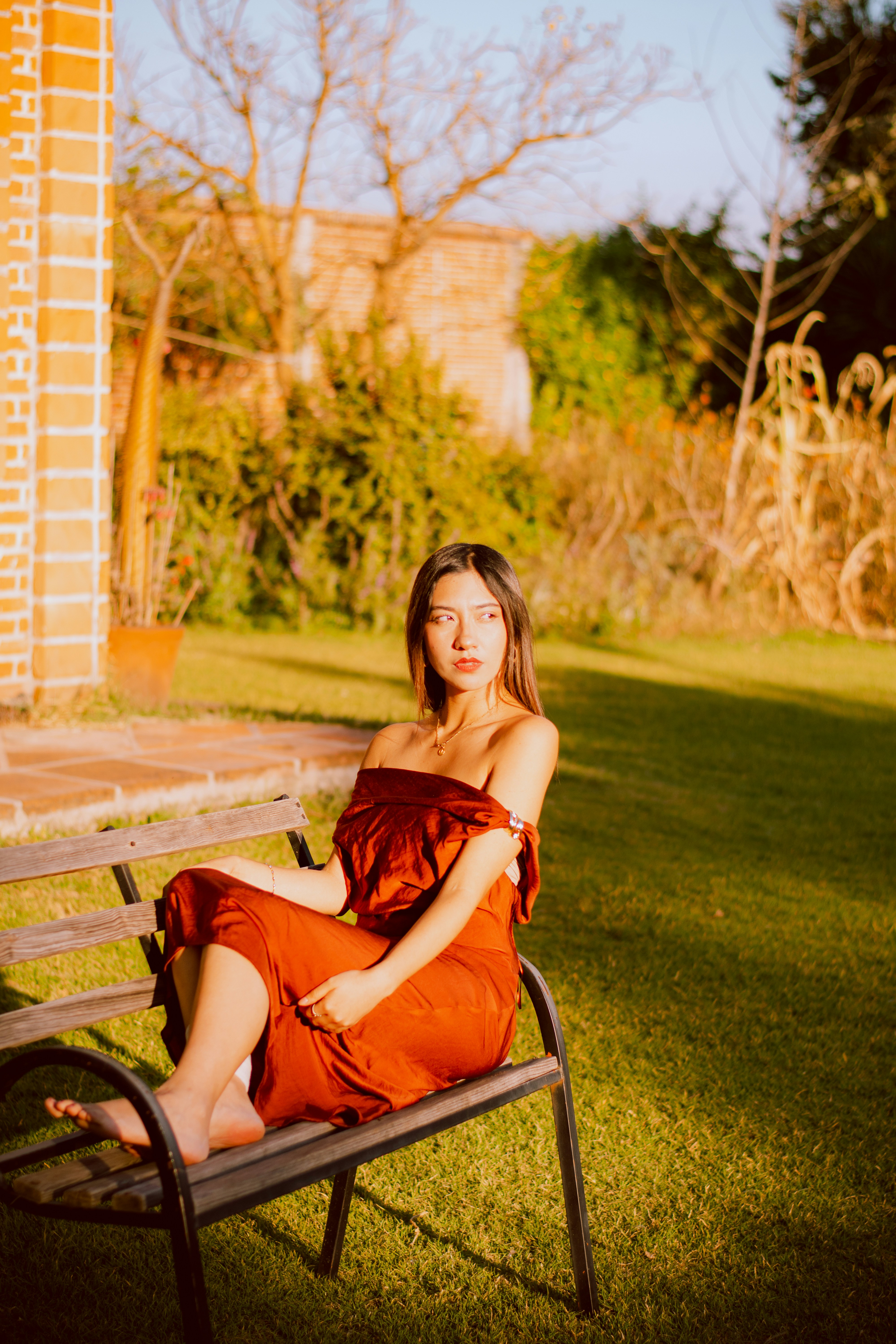 Sunlit Red Dress Portrait in a Quiet Garden