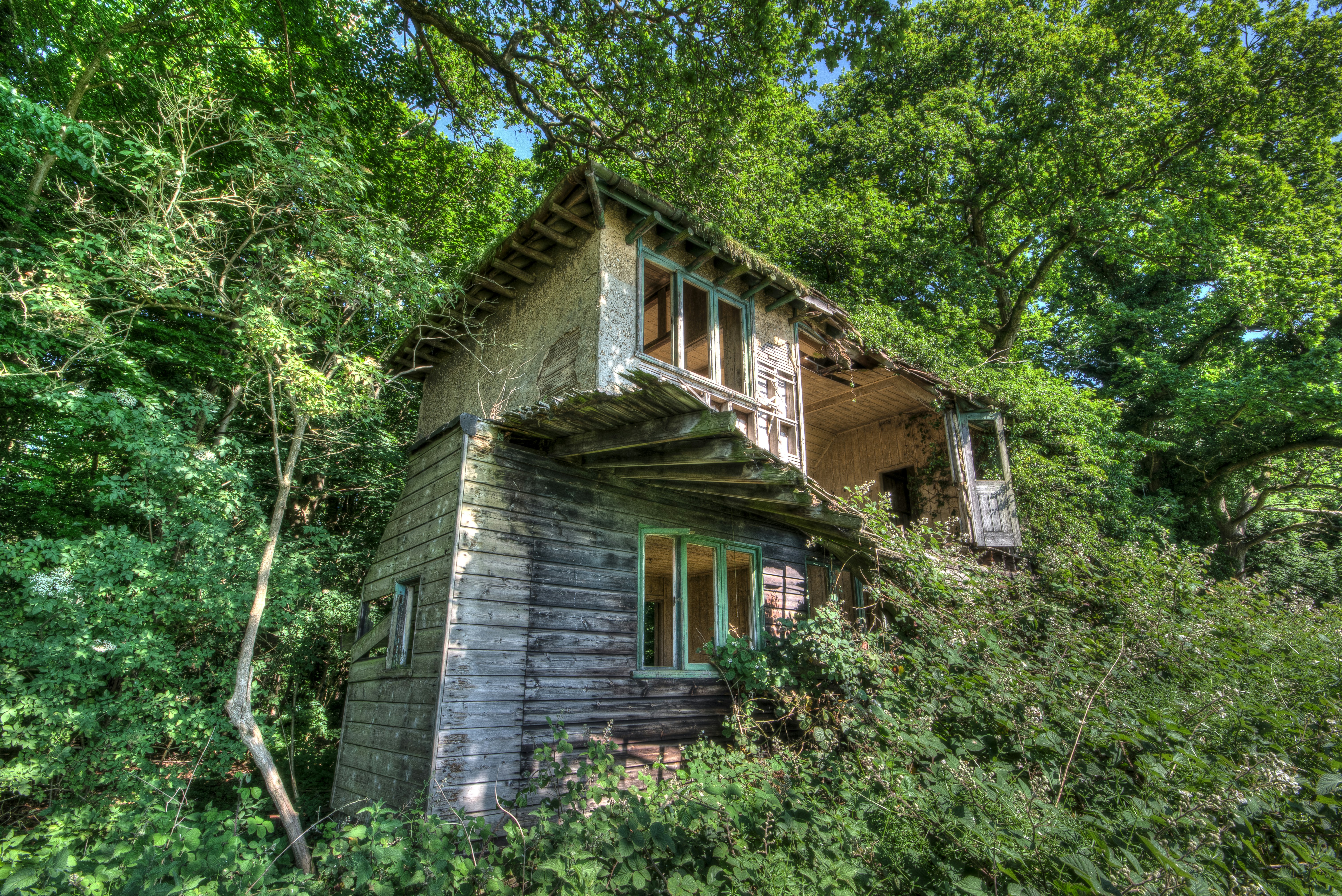 Abandoned Cabin Clinging to the Green Cliffs