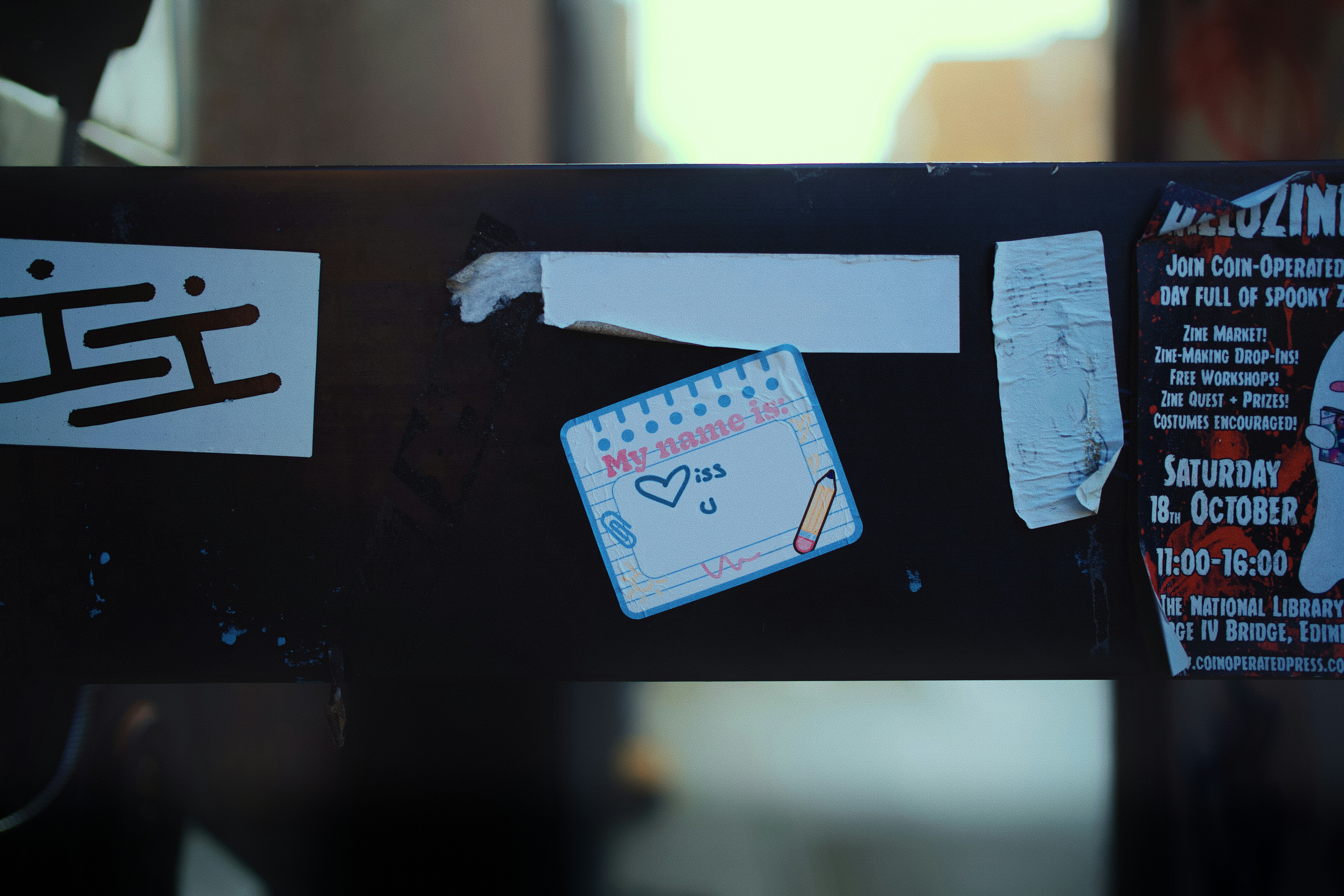 Sticky Sign and Posterboard in a Dim Corridor