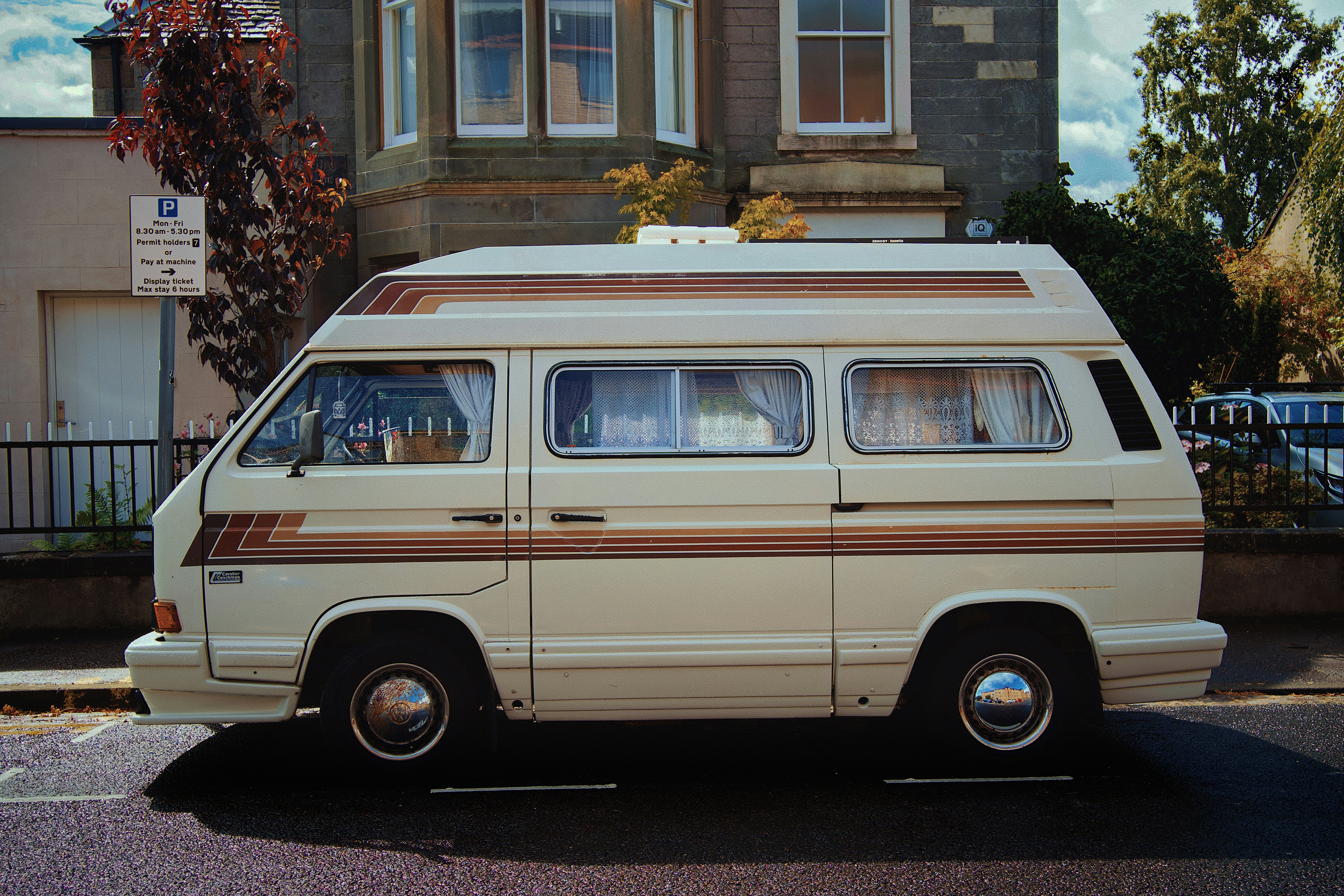 Retro Camper van in a sunlit suburban street