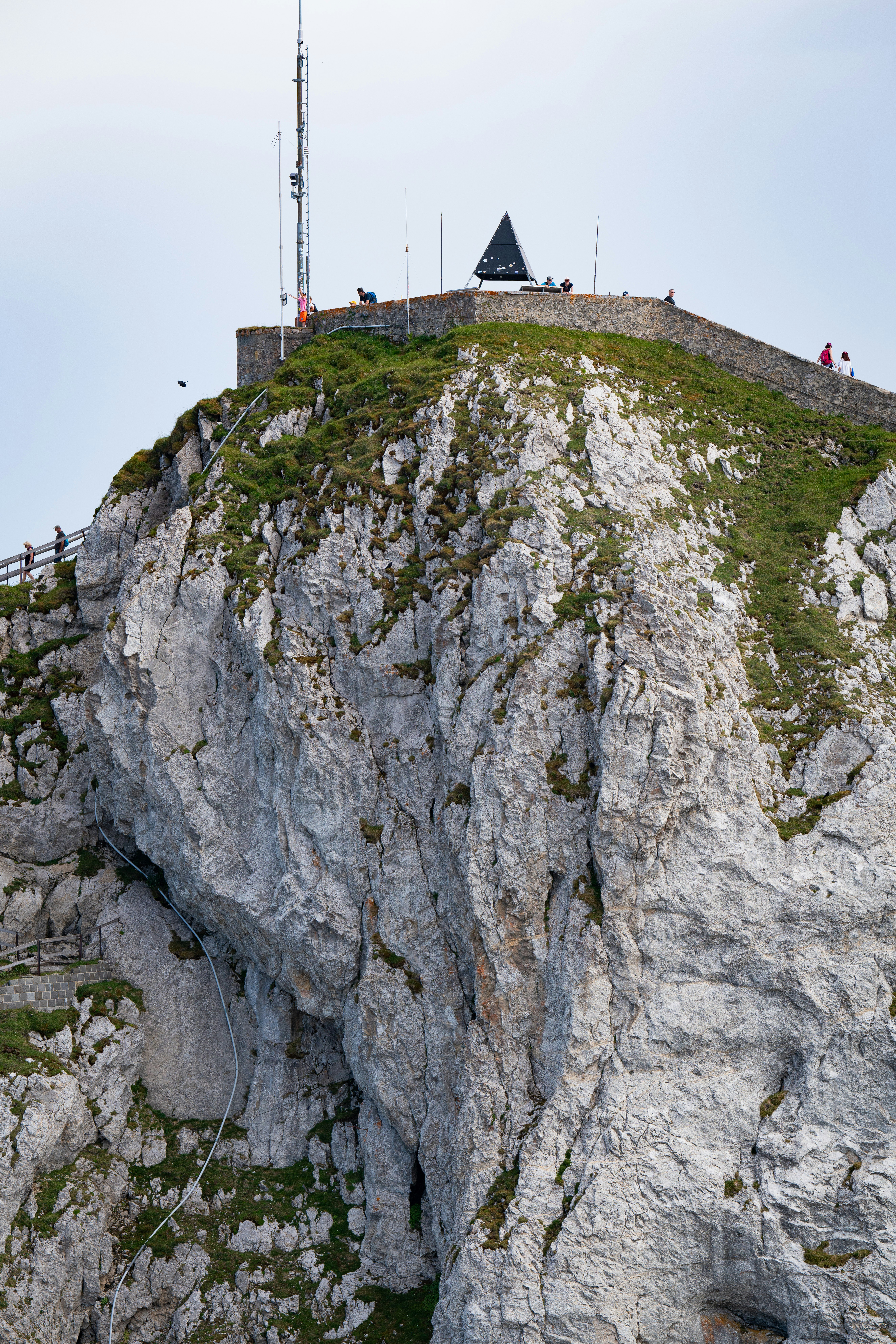 Atop the Cliff: Summit Obelisk and Skyward Visitors