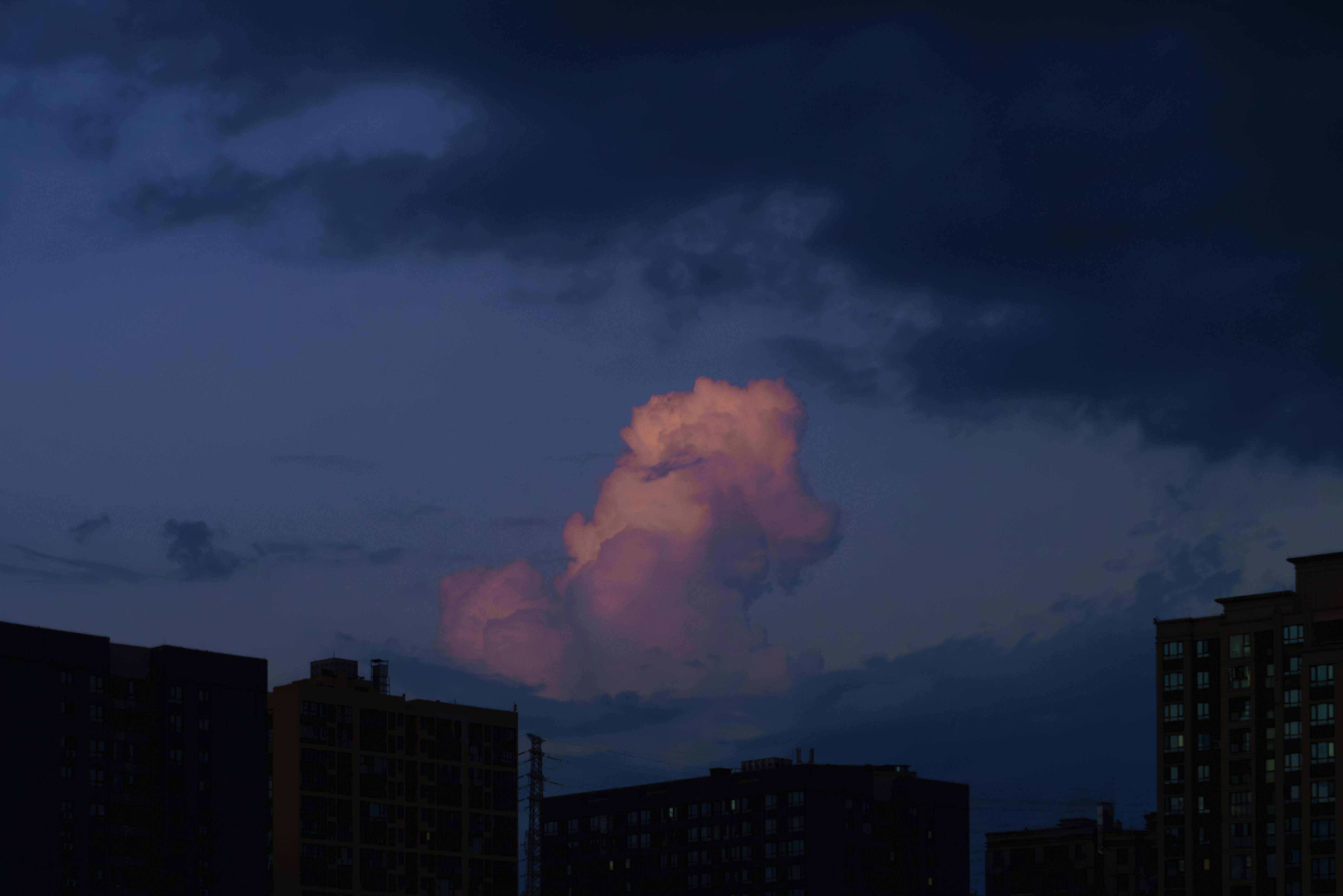 Cloud Burst Over Silent City at Dusk