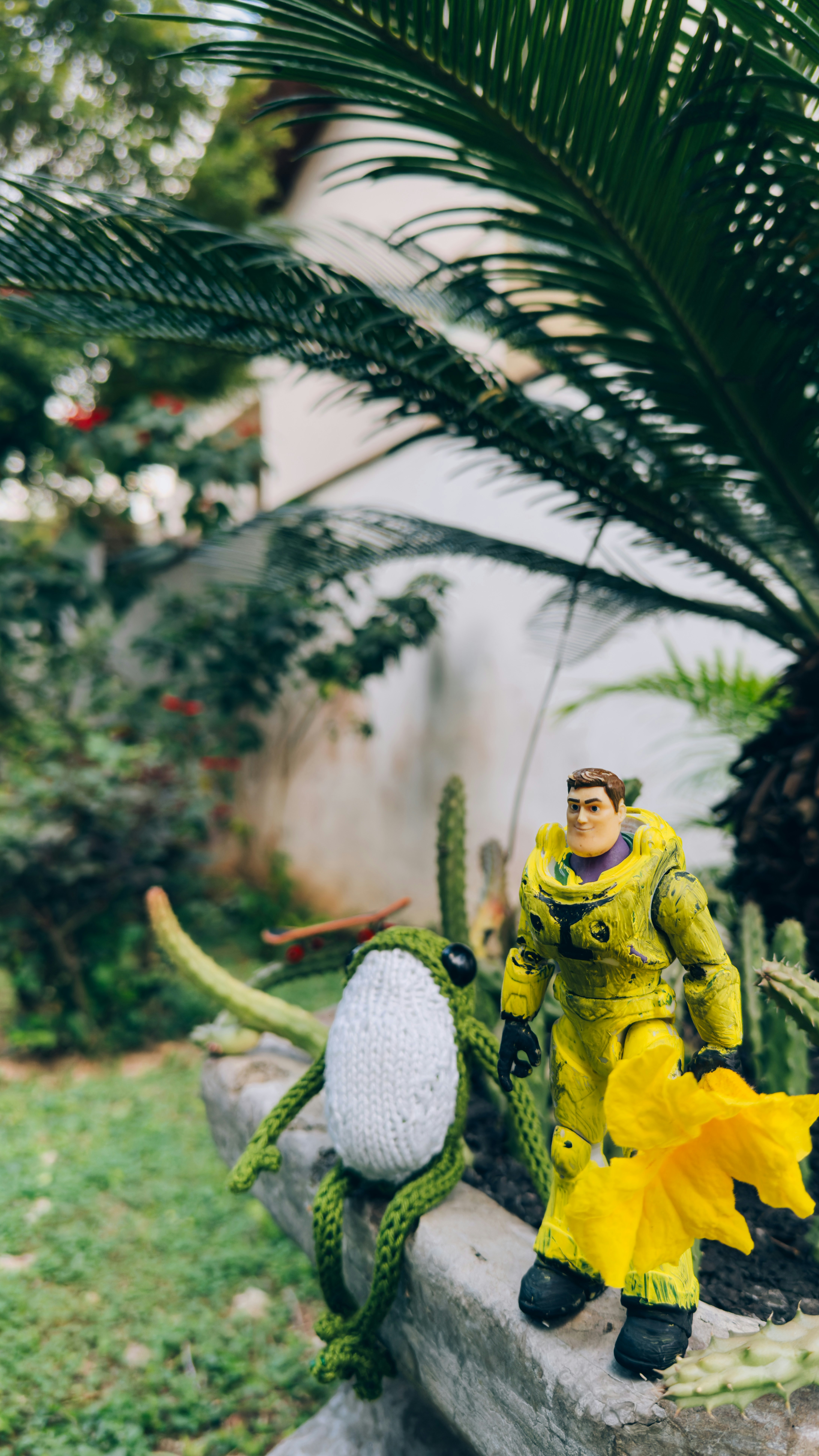 Toy Astronaut Guards a Sunlit Garden Oasis