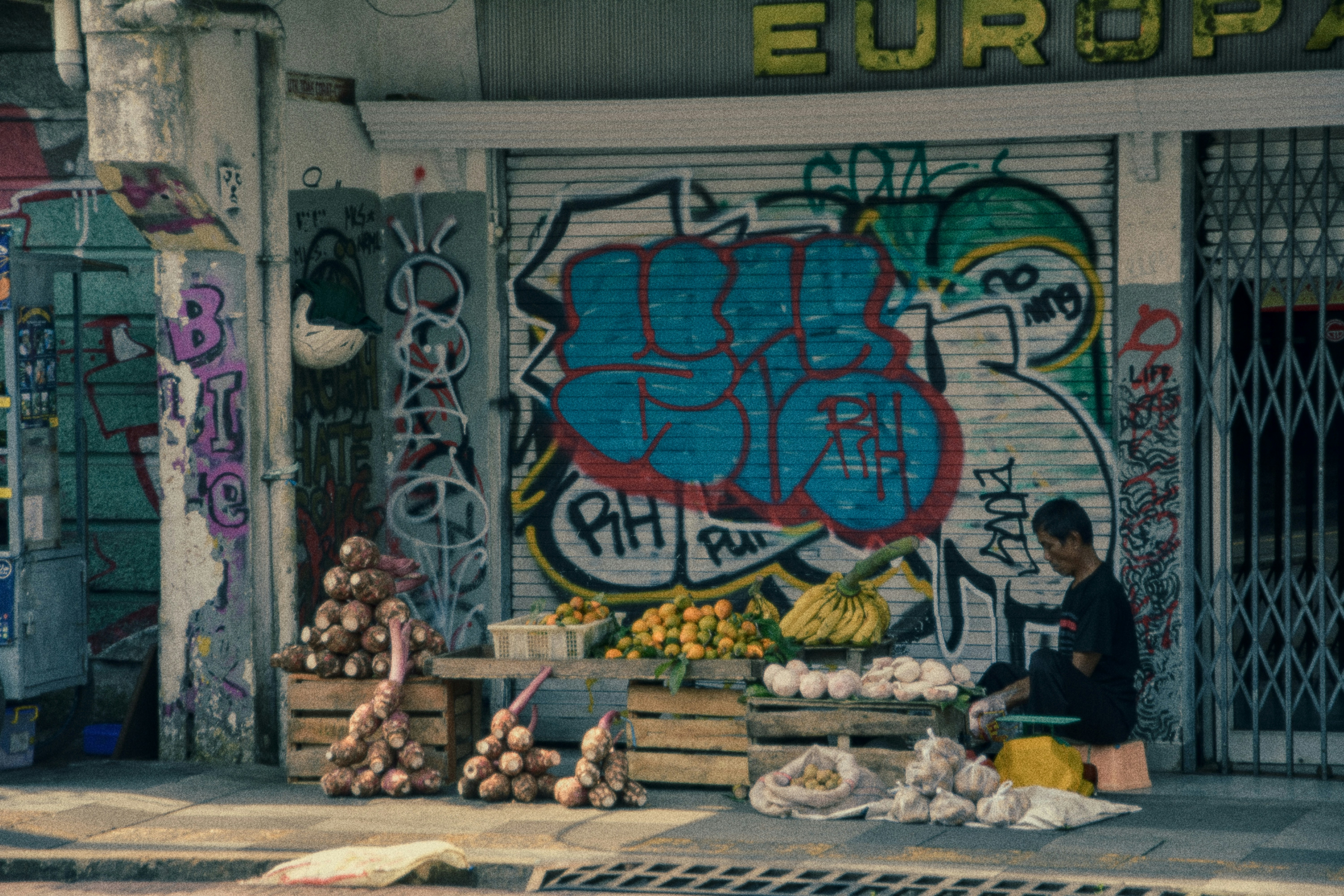 Graffiti Wall Overhang Meets Orchard Stall