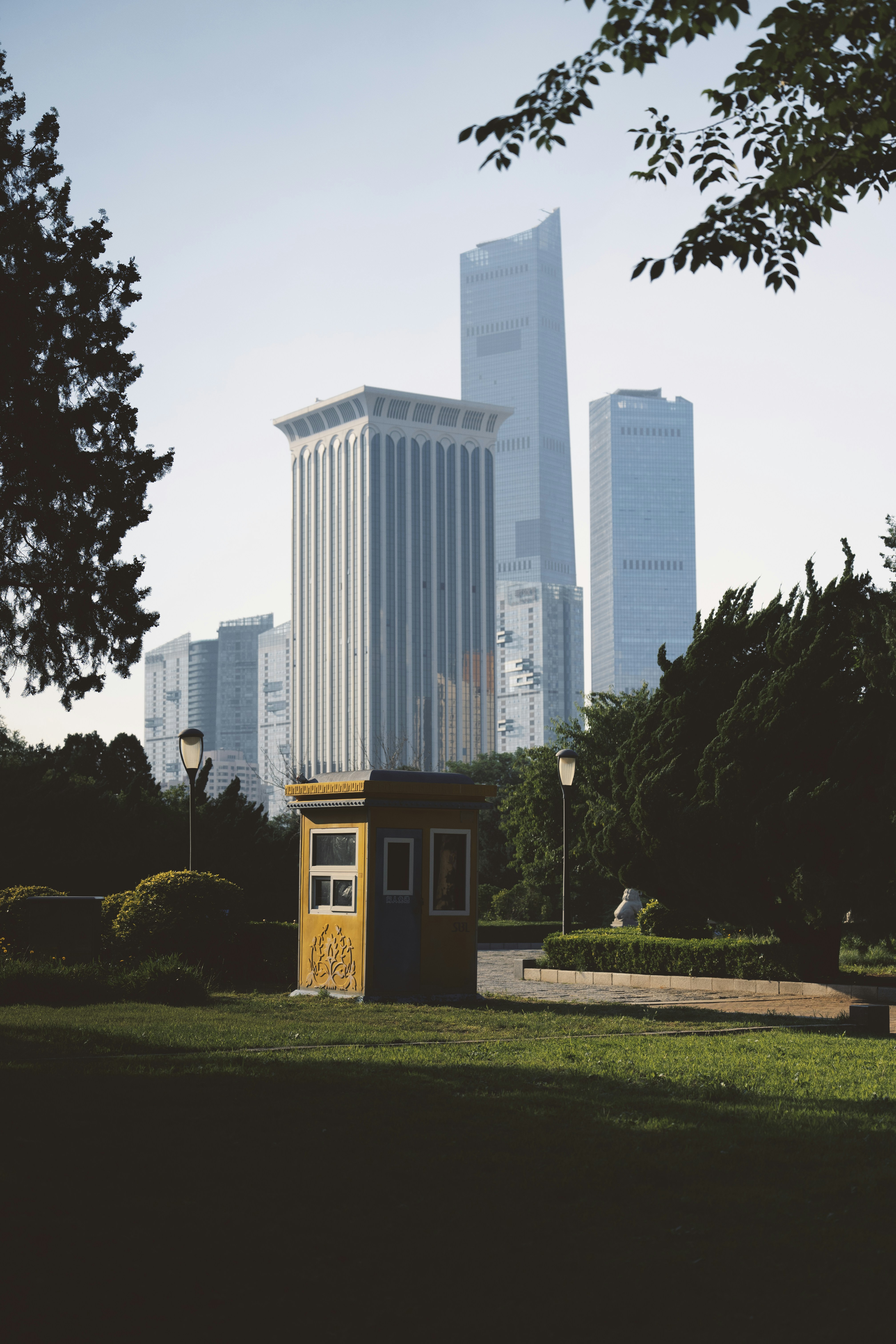 Guarded by Glass Towers: A Parkside View of Urban Giants