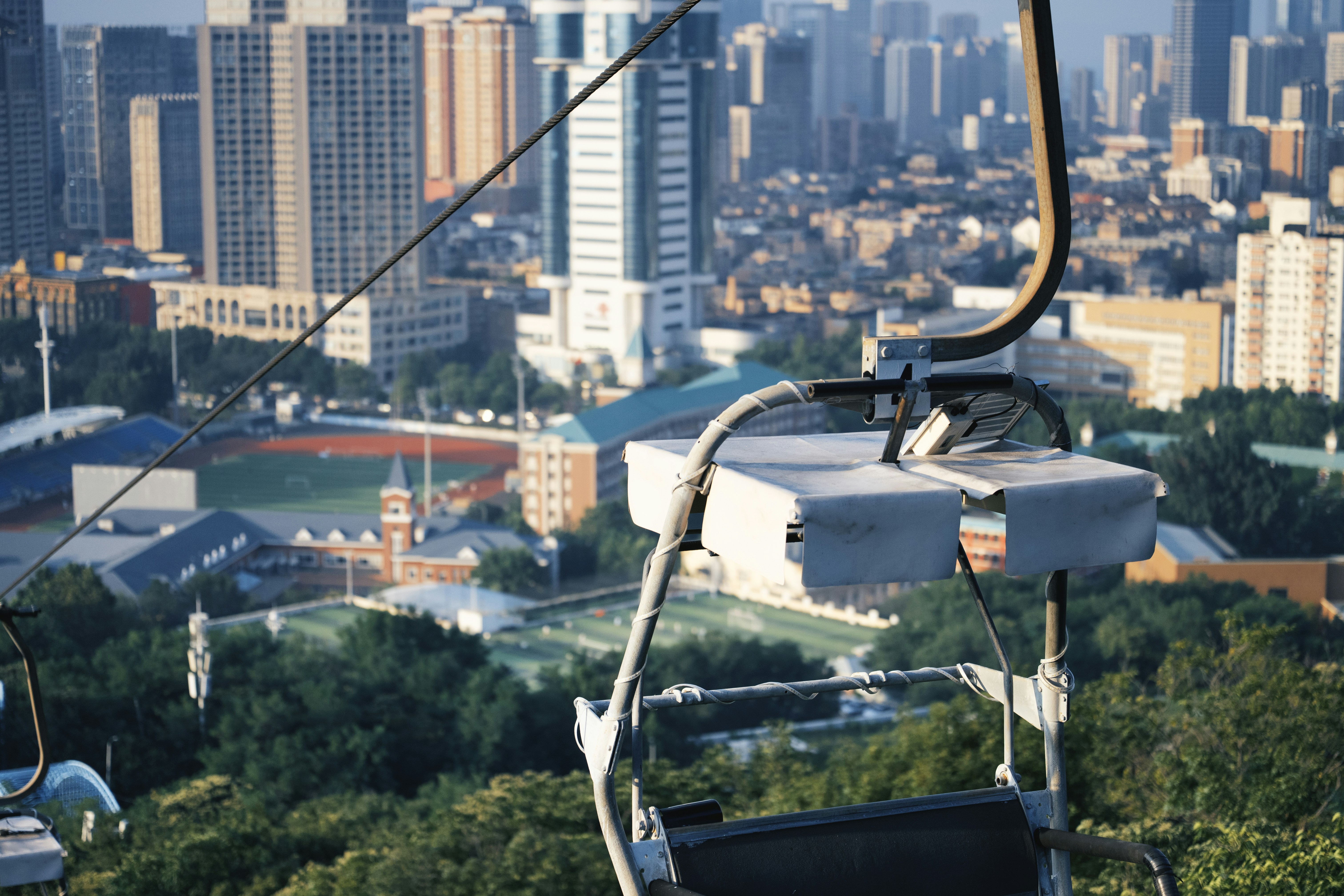 Rope-Driven Summit Chair over Cityscape