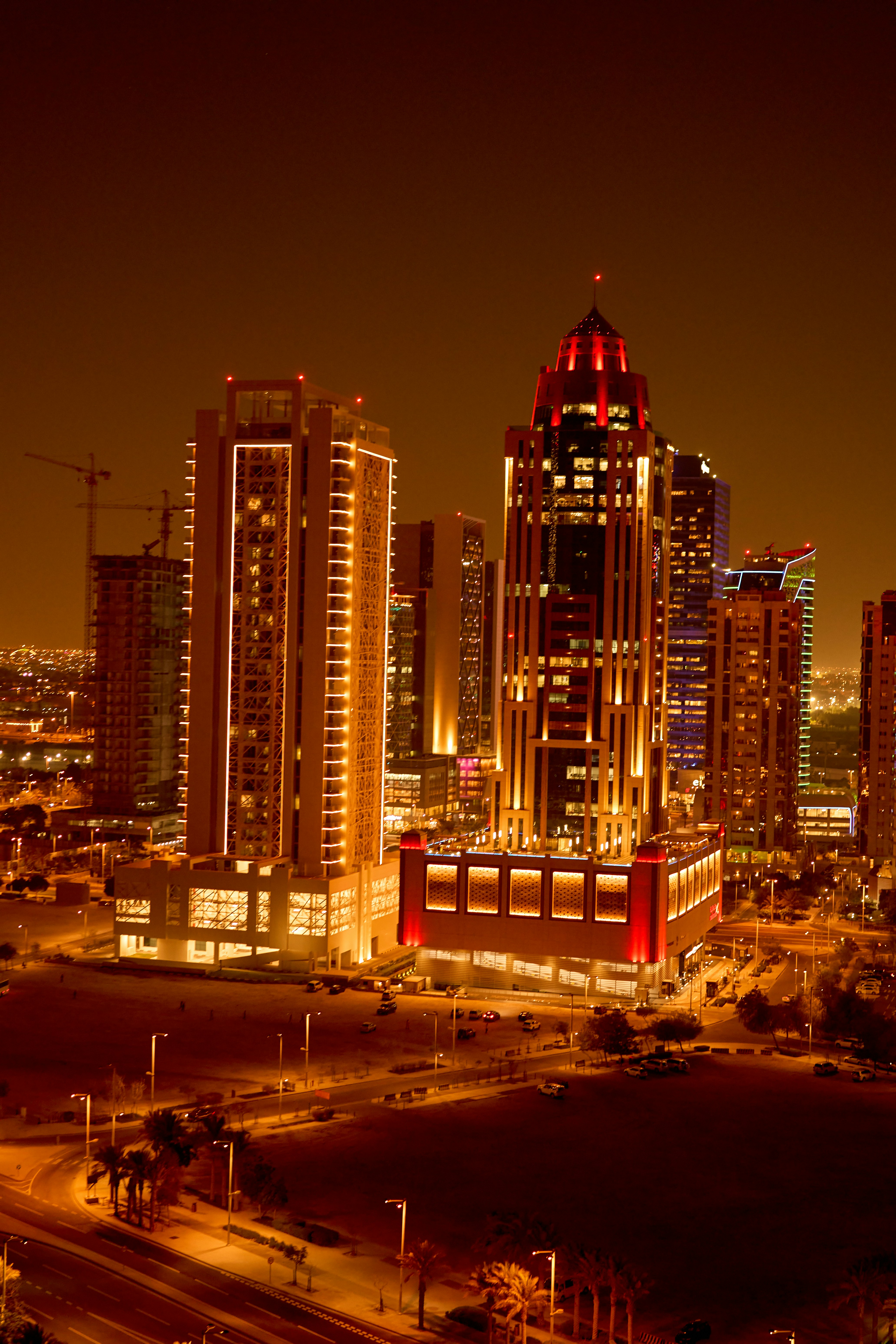 Crimson Skyline: Neon Towers Crown the Desert Night
