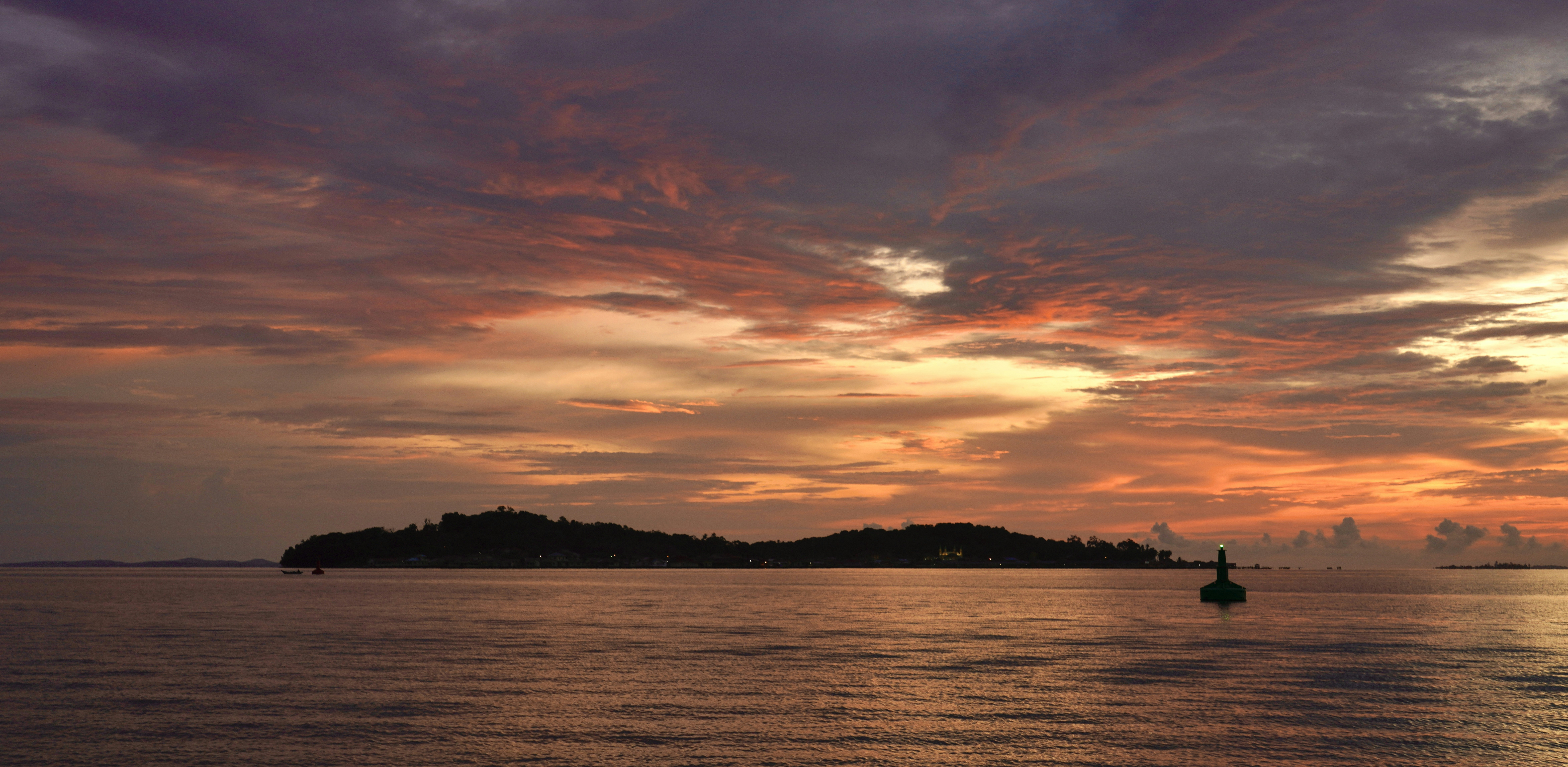 Harbor at Sunset: Quiet Horizon Beneath Fiery Skies