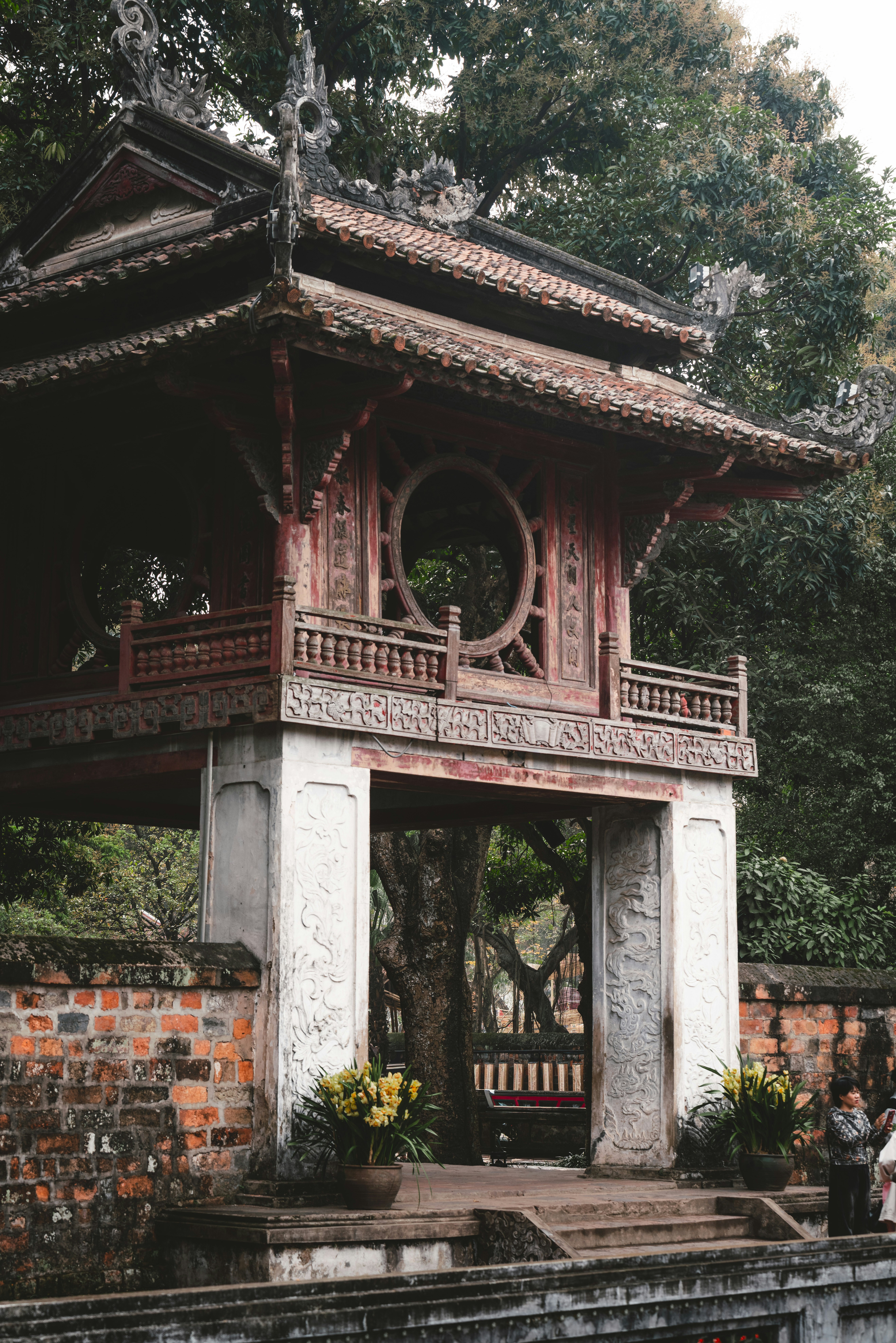Shrine Gate in a Quiet Courtyard: Weathered Carvings and Framing
