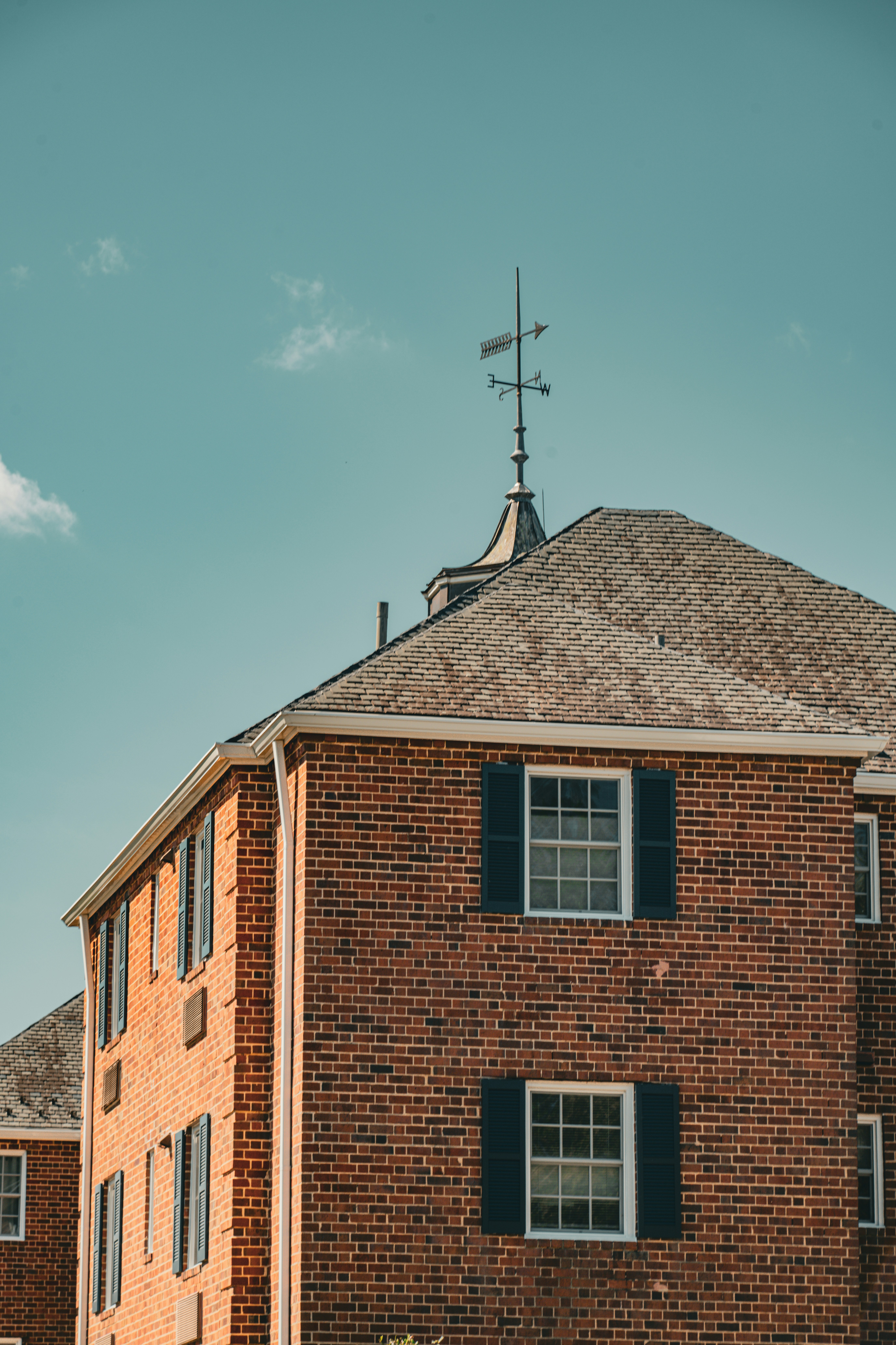 Brick Cornerhouse Under a Turquoise Sky