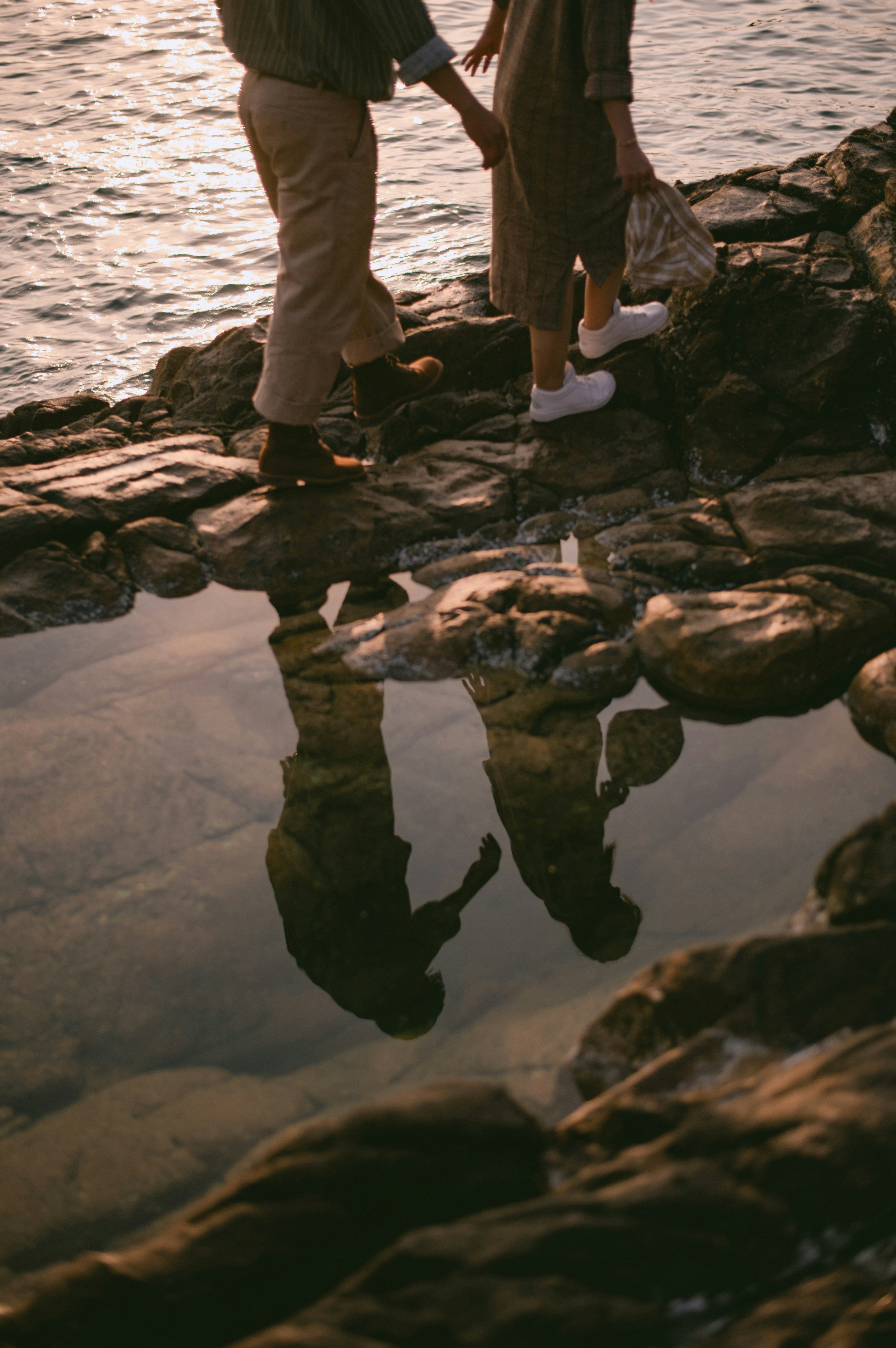 Footsteps on Moonlit Rocks: A Quiet Harbor Moment