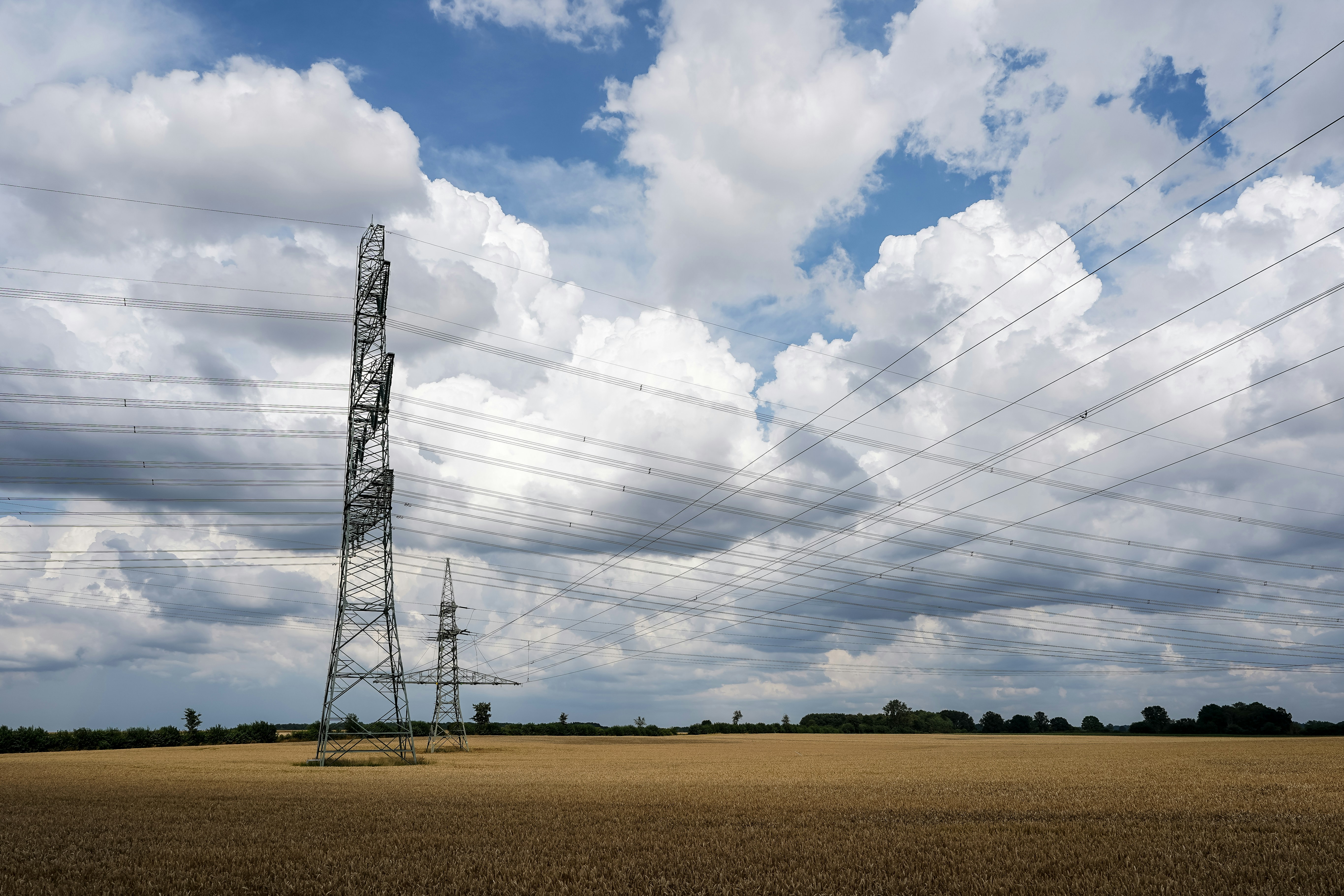 Field of Silence: Power Lines under a Tempest Sky