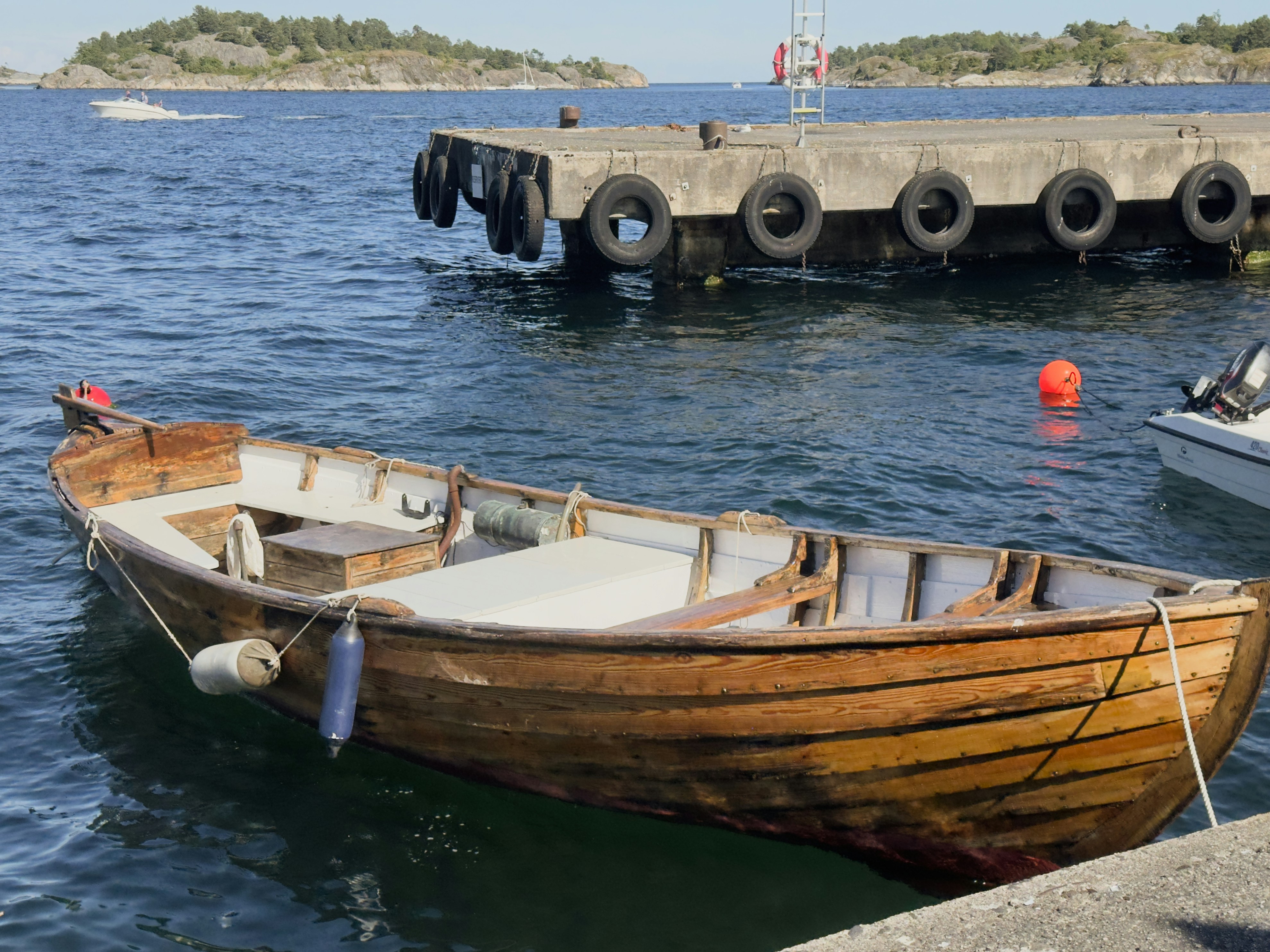 Sunlit Wooden Boat at the Quiet Pier