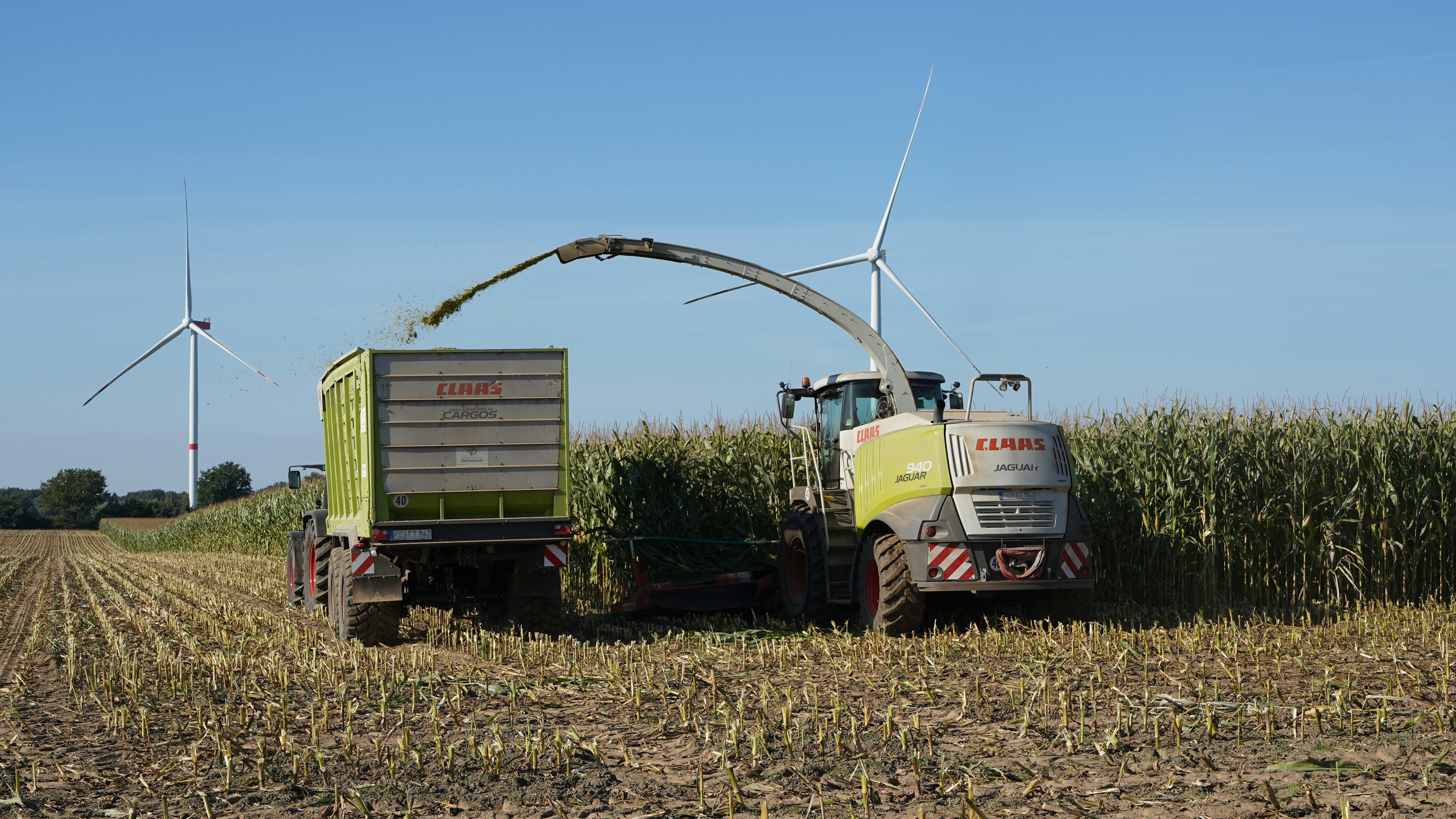 Harvest in Motion: The Windward Combine at Dusk Field