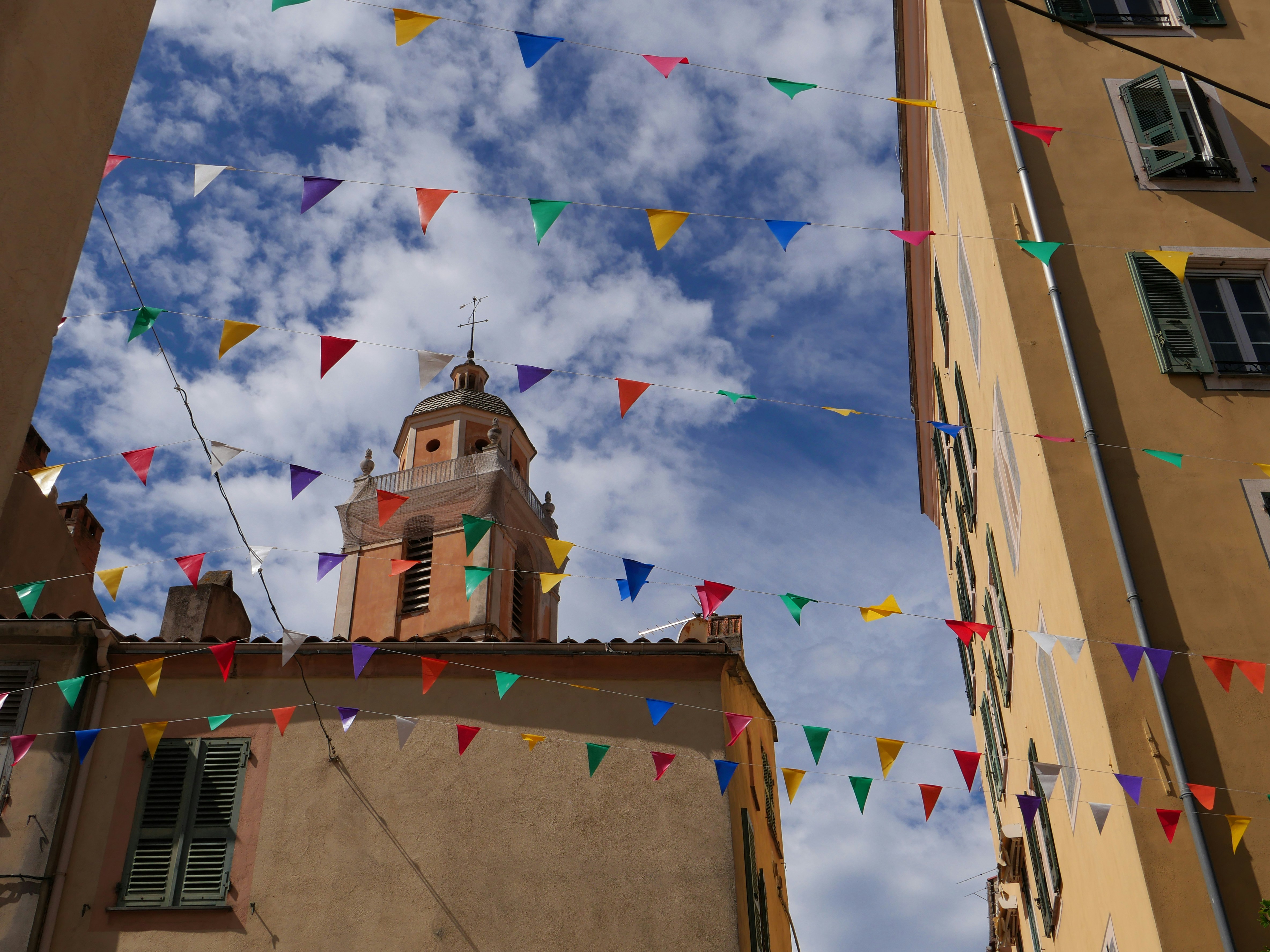 Festival Flags Over a Sunlit Old Town