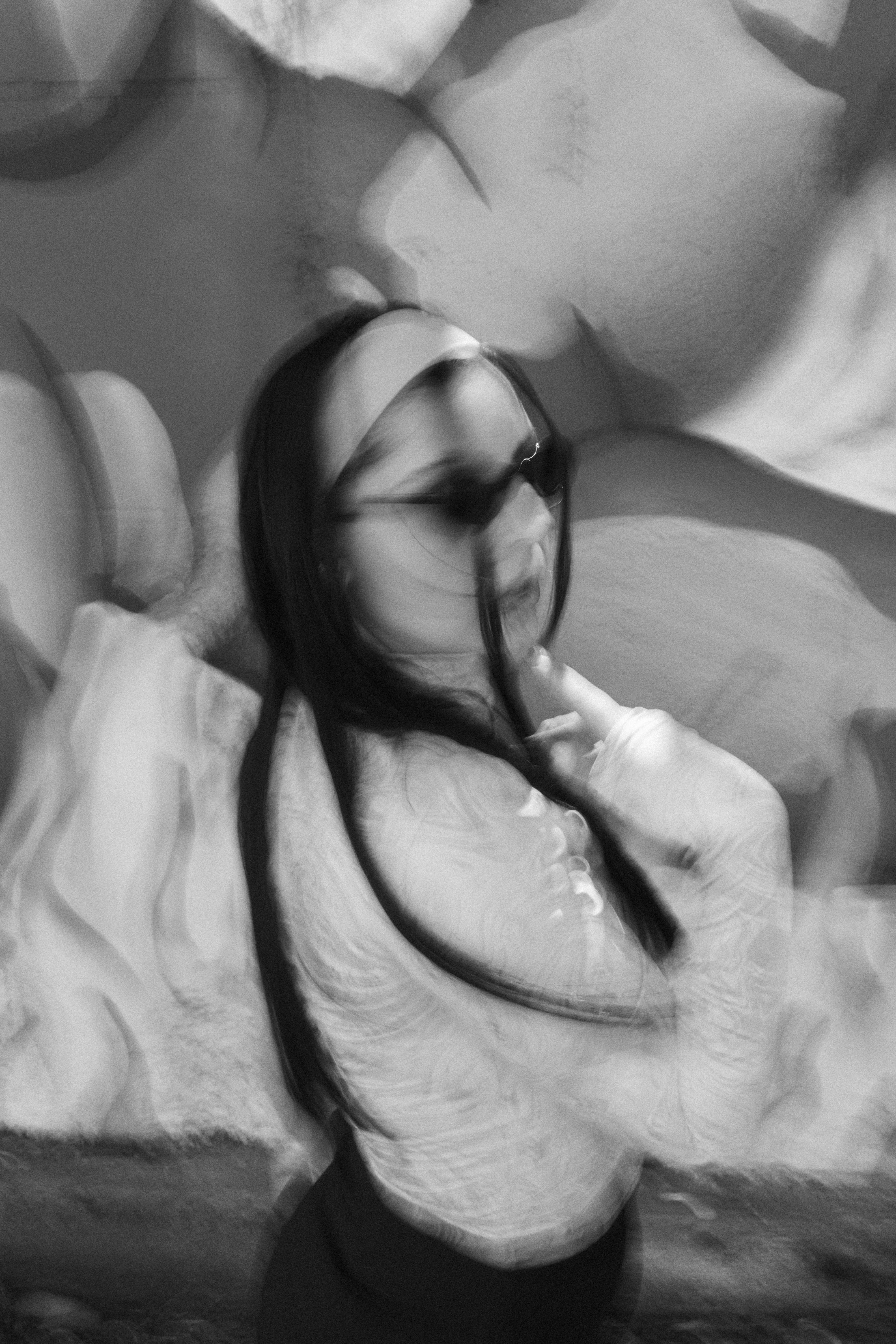 Blurred Motion of a Portrait in Shadow and Sunglasses