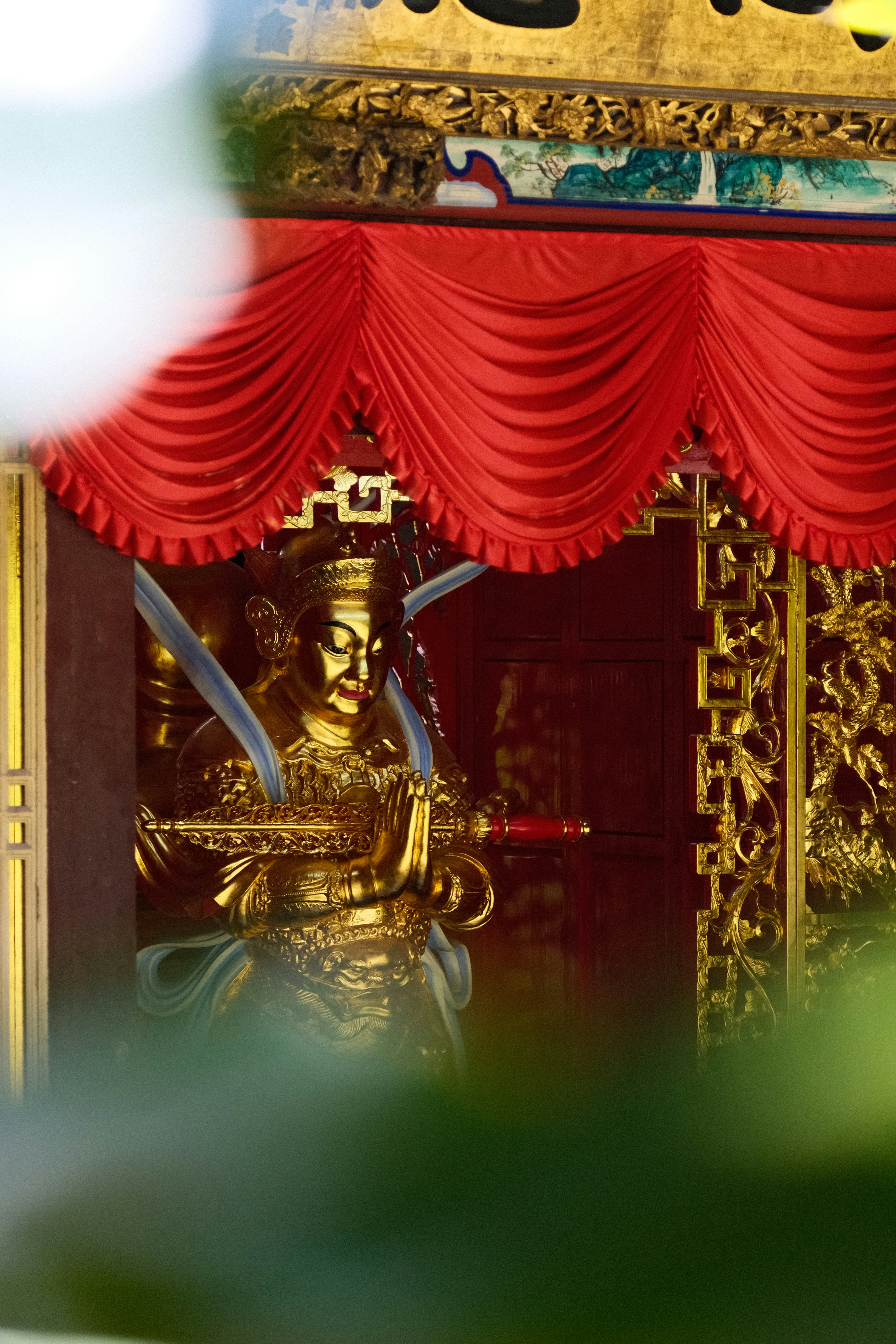 Golden Guardian in Red Draped Hall