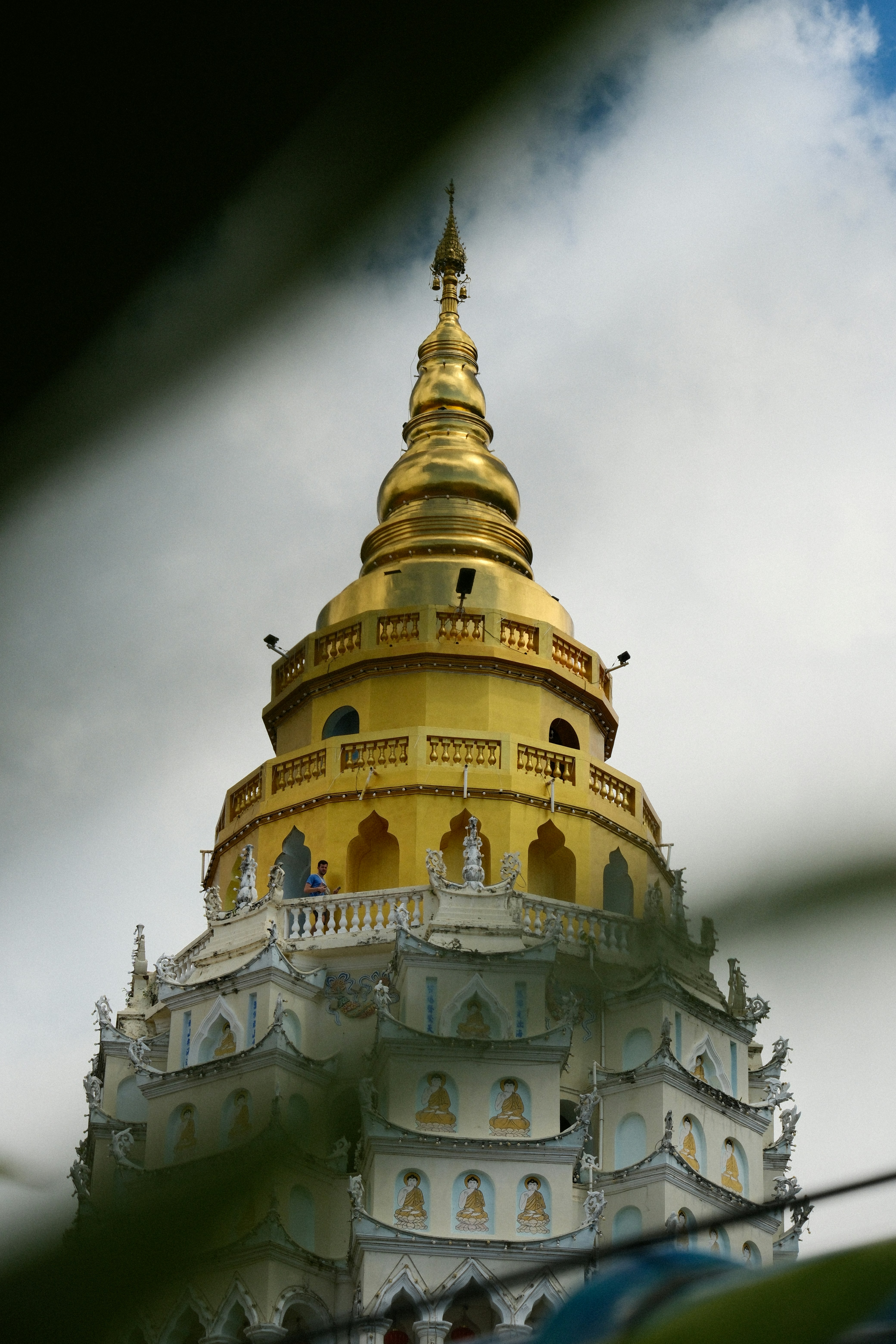 Gold Stupa Rising: Architectural Tiers Torch the Sky