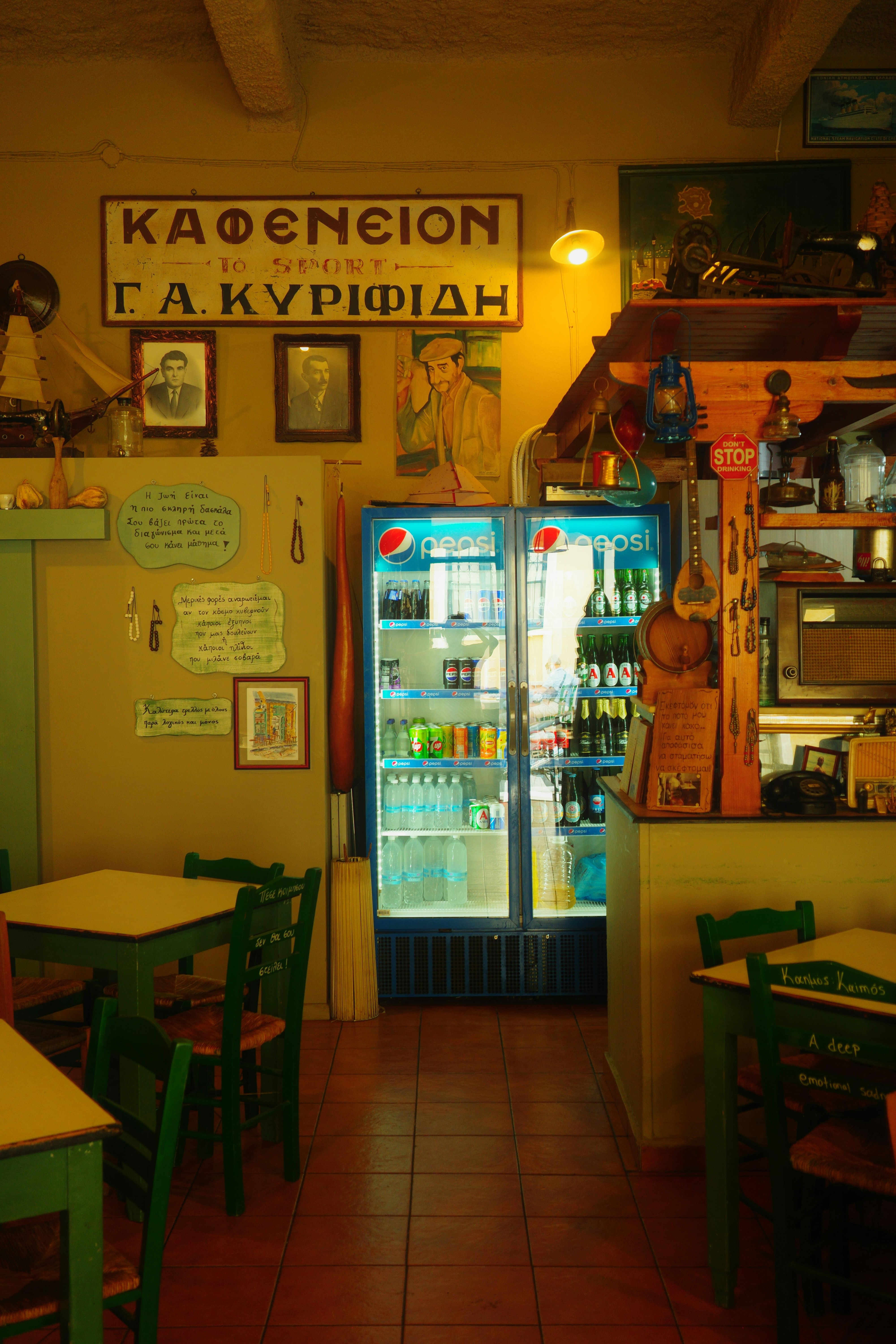 Warm Tavern Chaos: A Retro Greek Café With Neon Fridge Glow