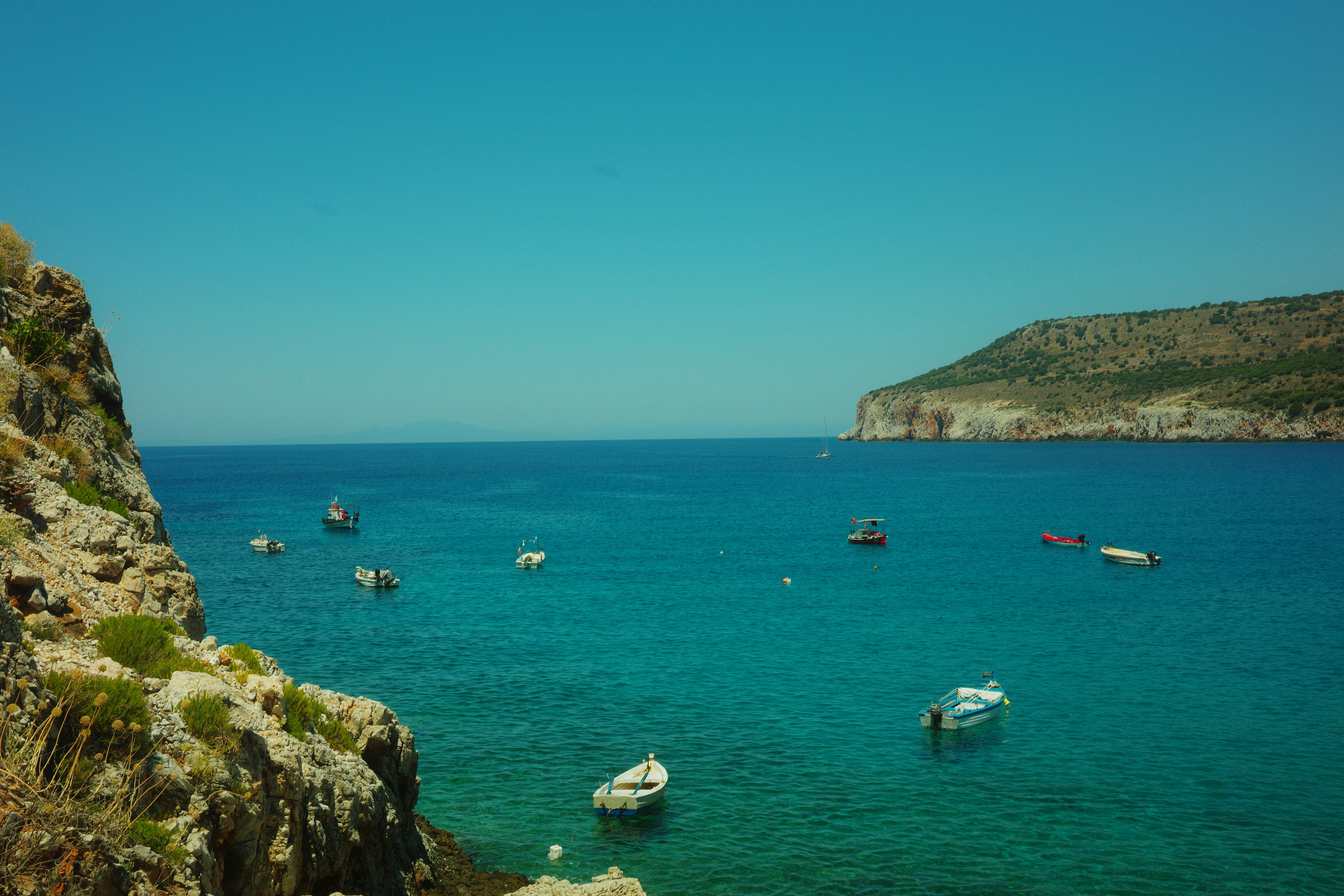 Azure Cove: Boats Quietly Rest in a Calm Costa