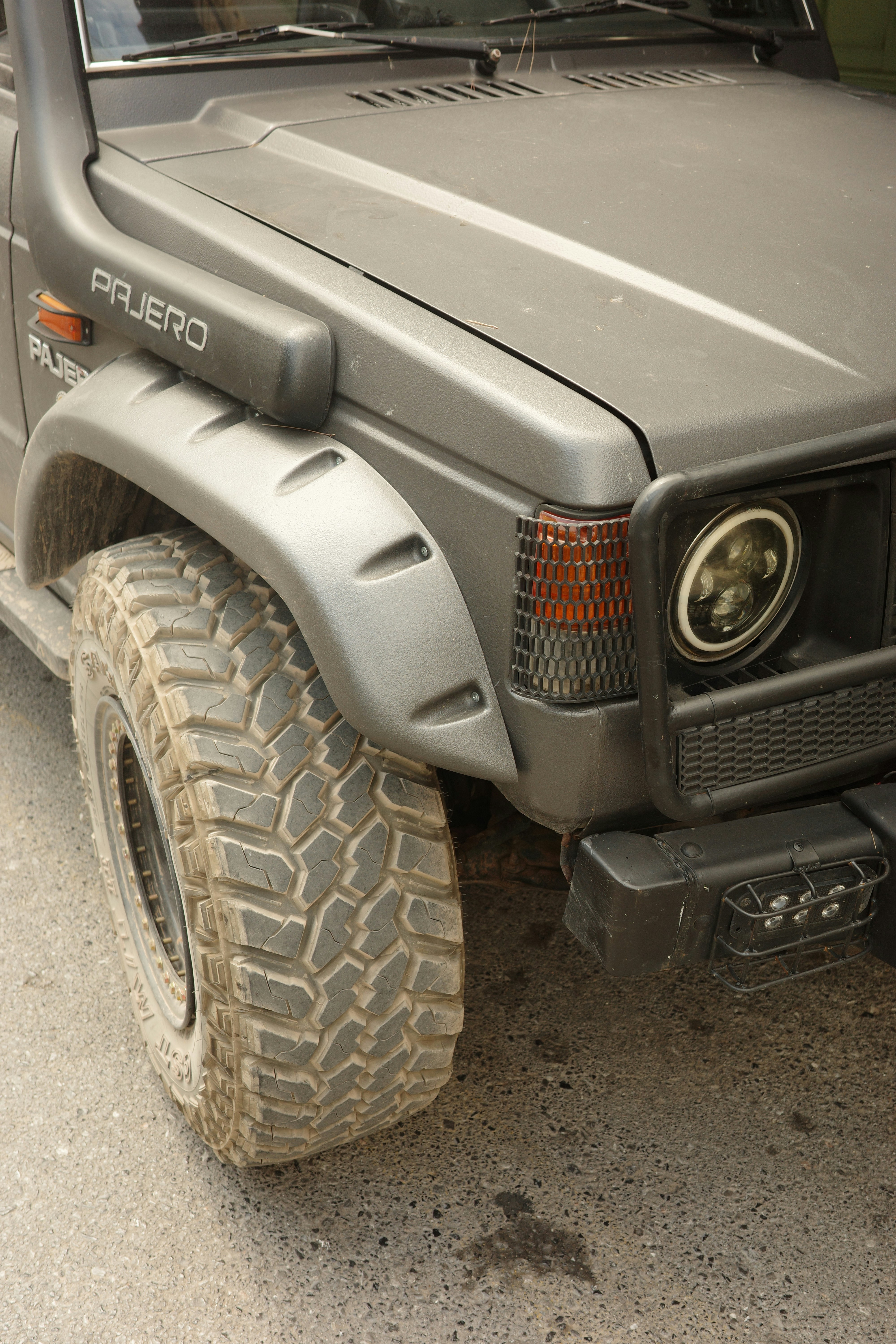 Rugged Front Portrait: A Trail-Ready Pajero Under Dusty Light