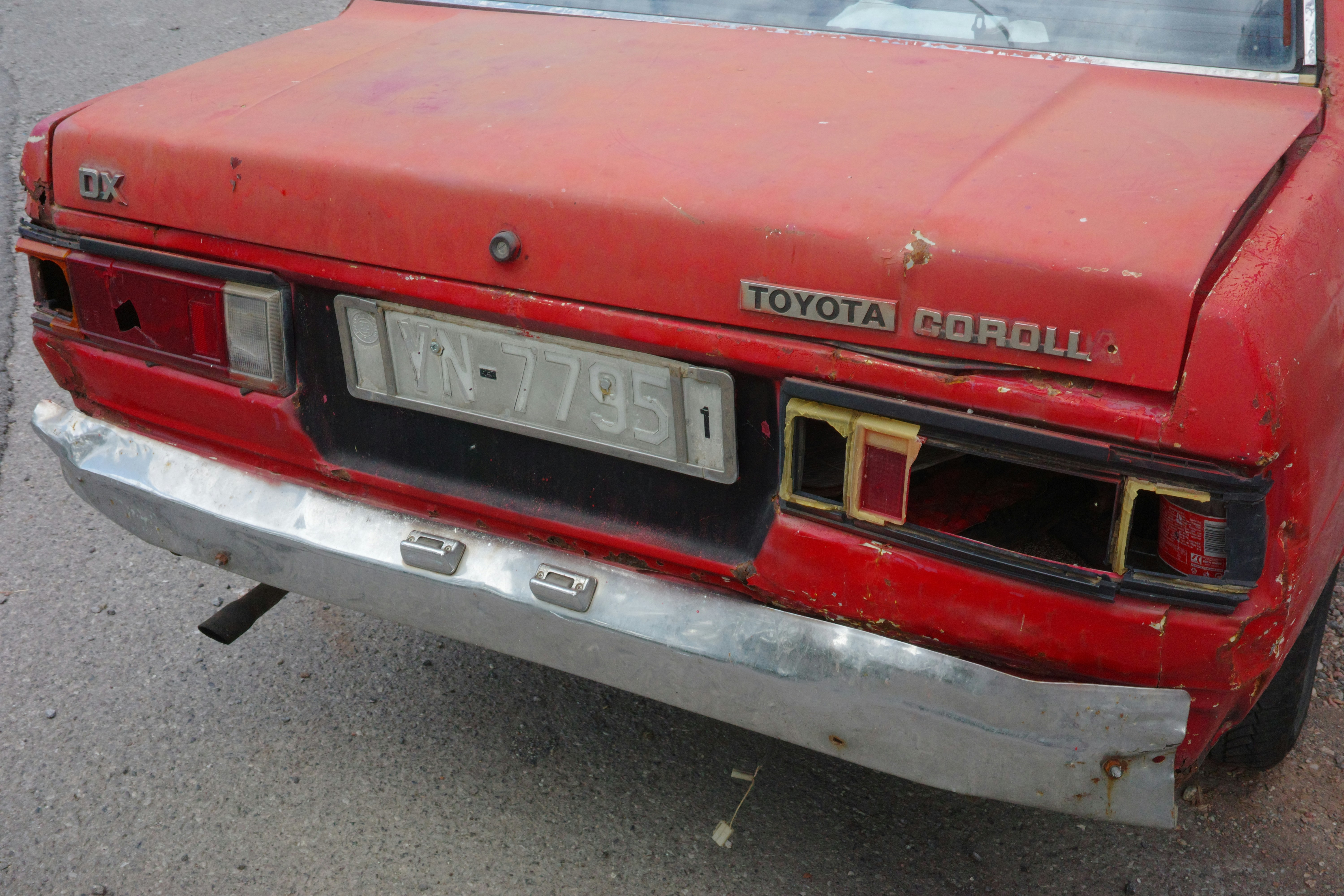 Rusty Toyota Corolla Emblem Under Fade and Chrome
