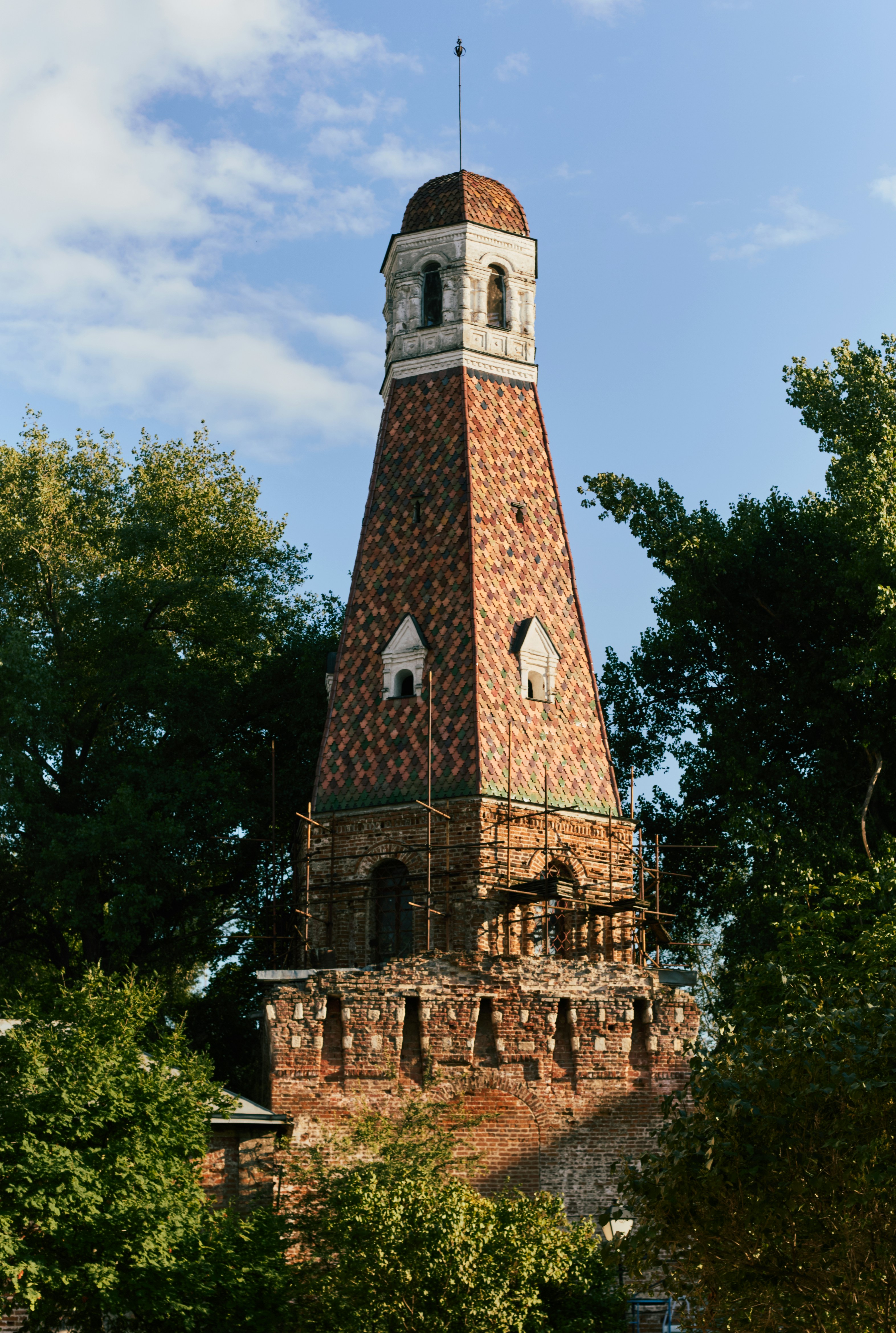 Tower of Tiles: A medieval beacon rising from ivy and brick