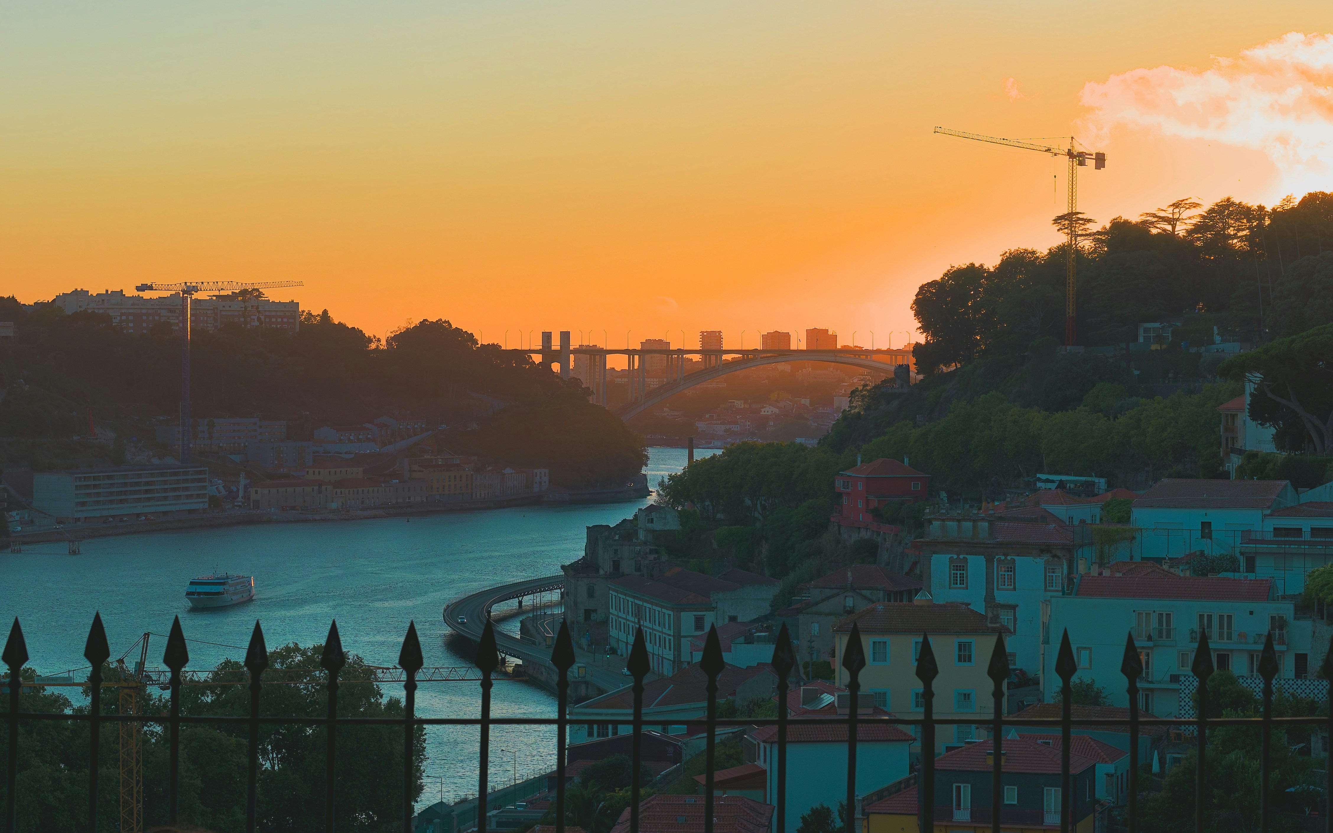 Sunset Over the Waterway: A Glimpse of the Distant Bridge