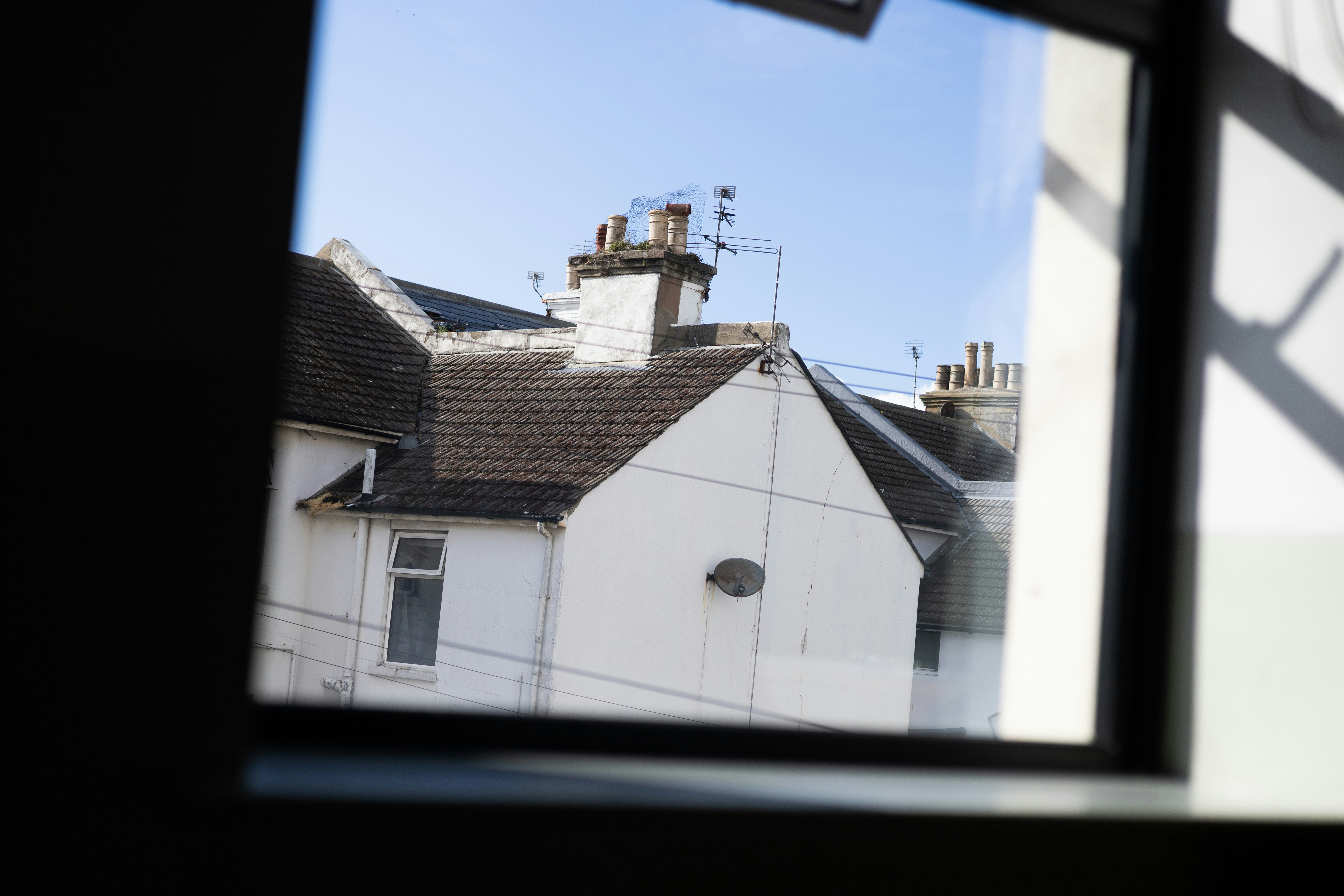  Rooftop Geometry through a Window Frame