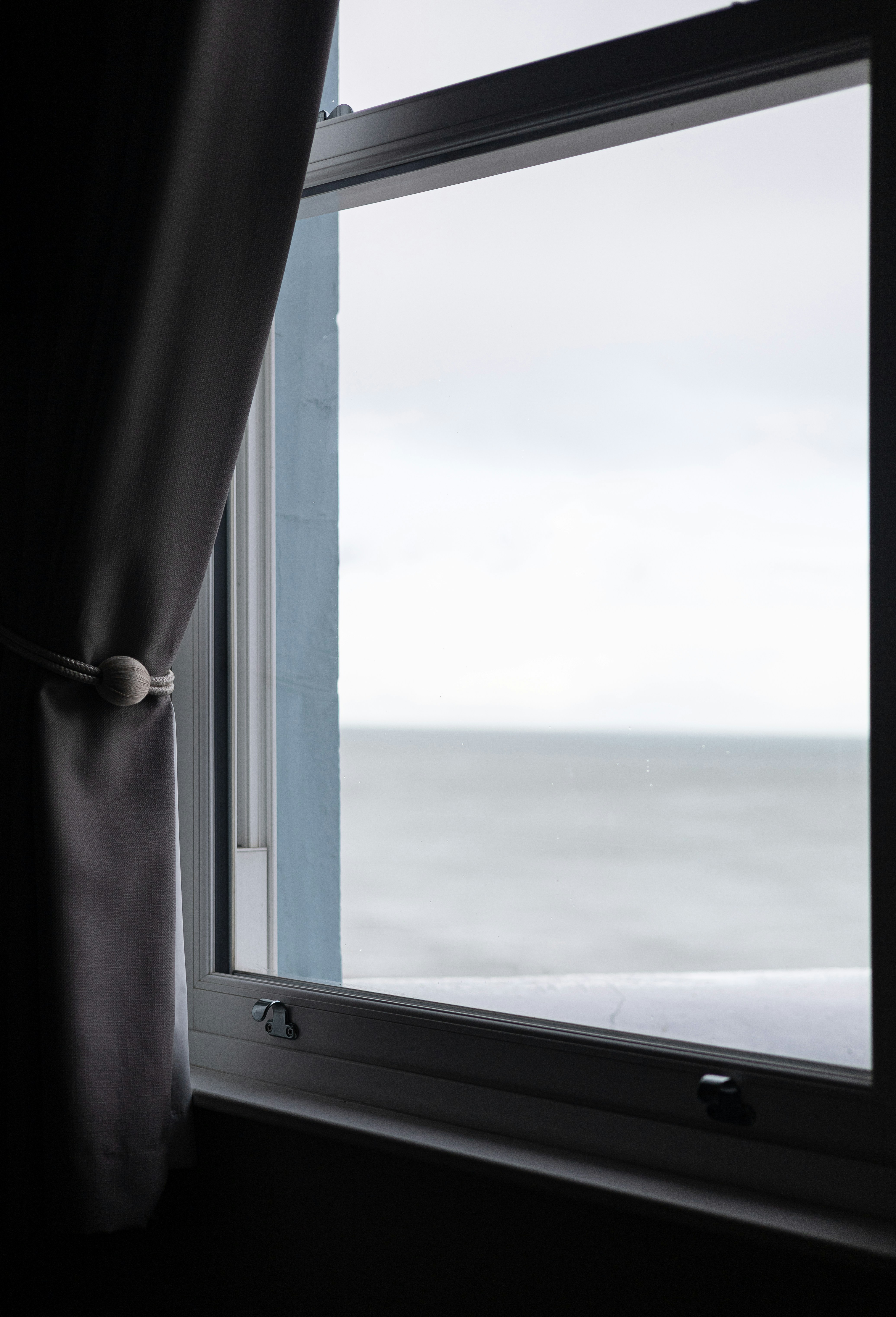Framed by Darkness: A Quiet Window to the Sea