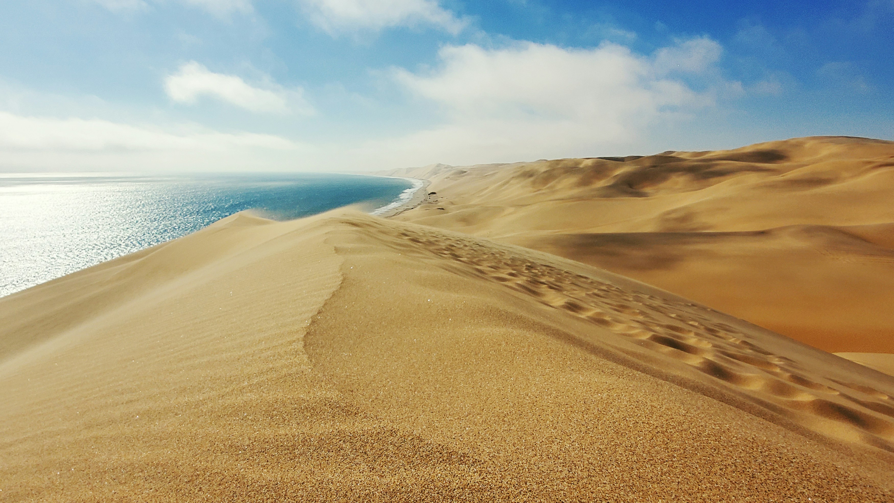 Sunlit Dunes: A Quiet Canyon of Golden Grains