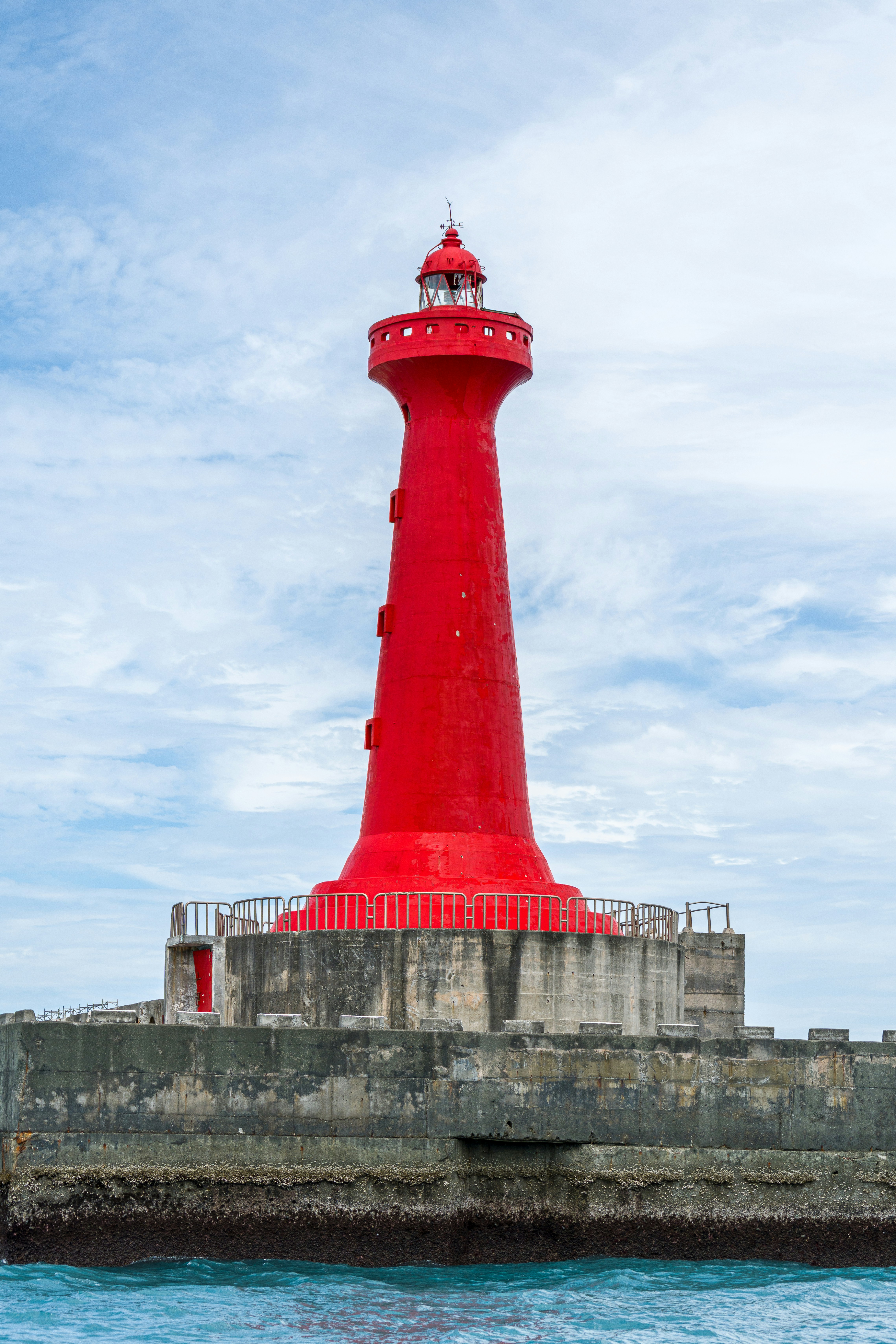 Crimson Beacon Rising from the Sea Wall