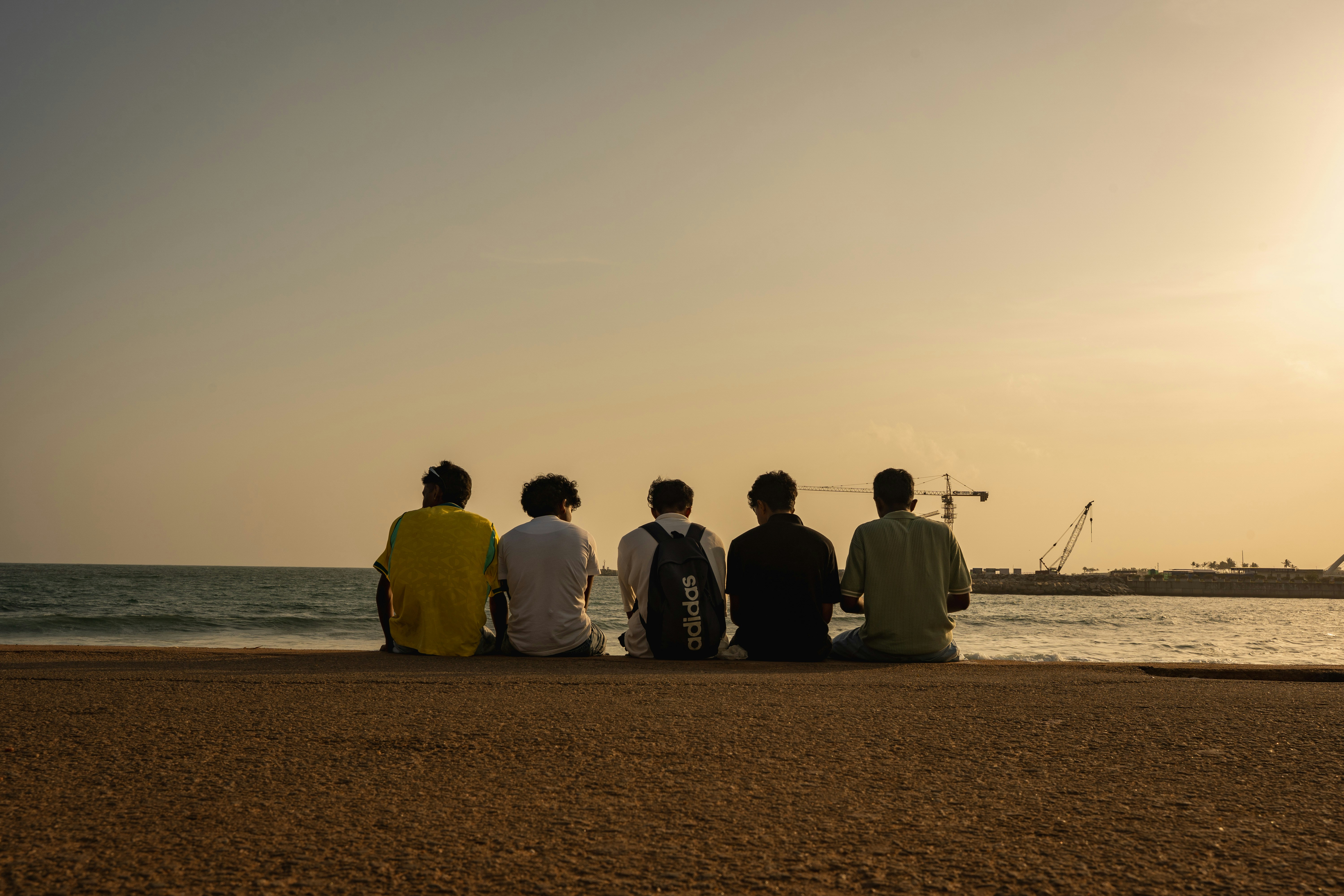 Six Friends on the Shoreline at Dusk