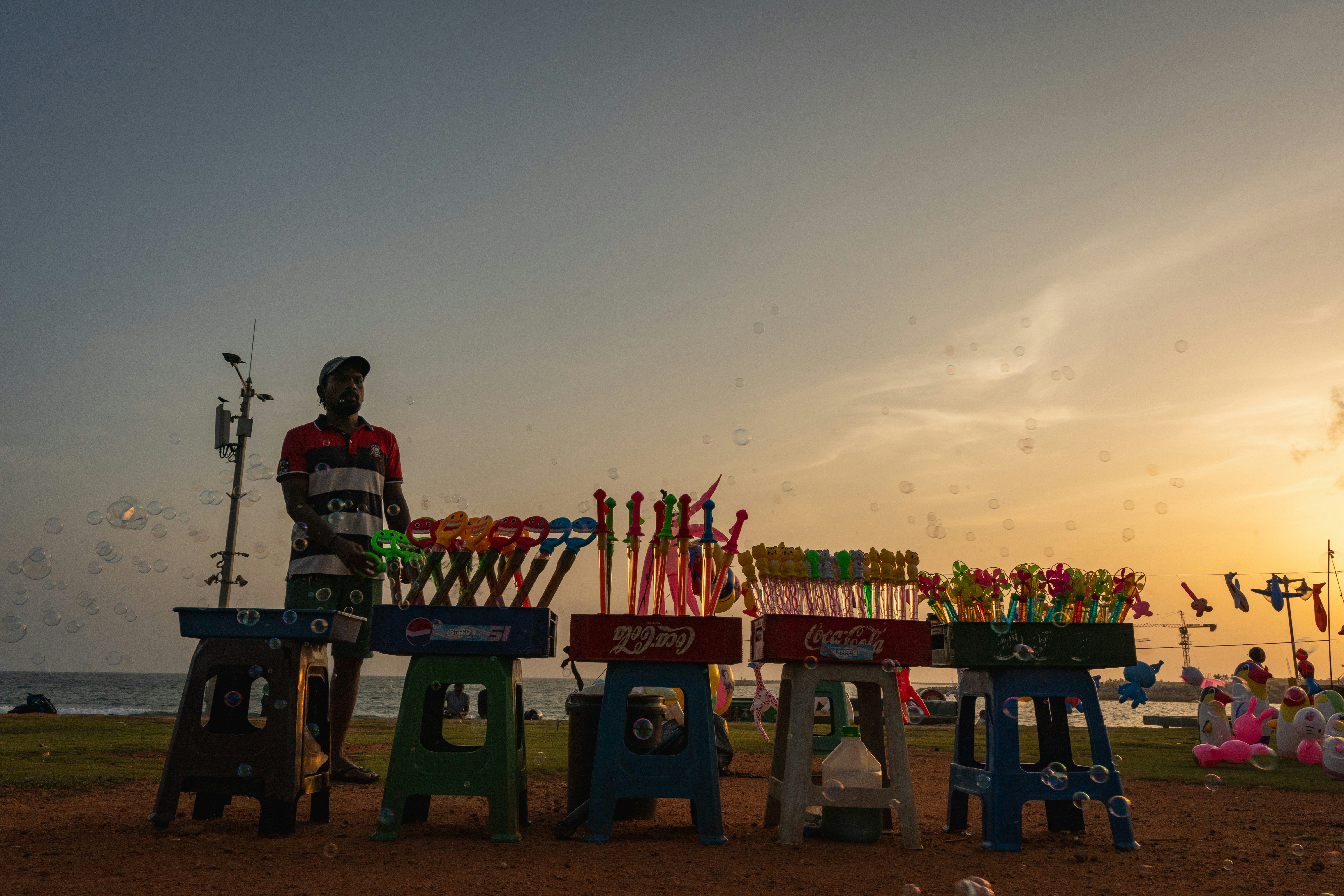 Kites and Colorful Stools at Sunset Beach Carnival