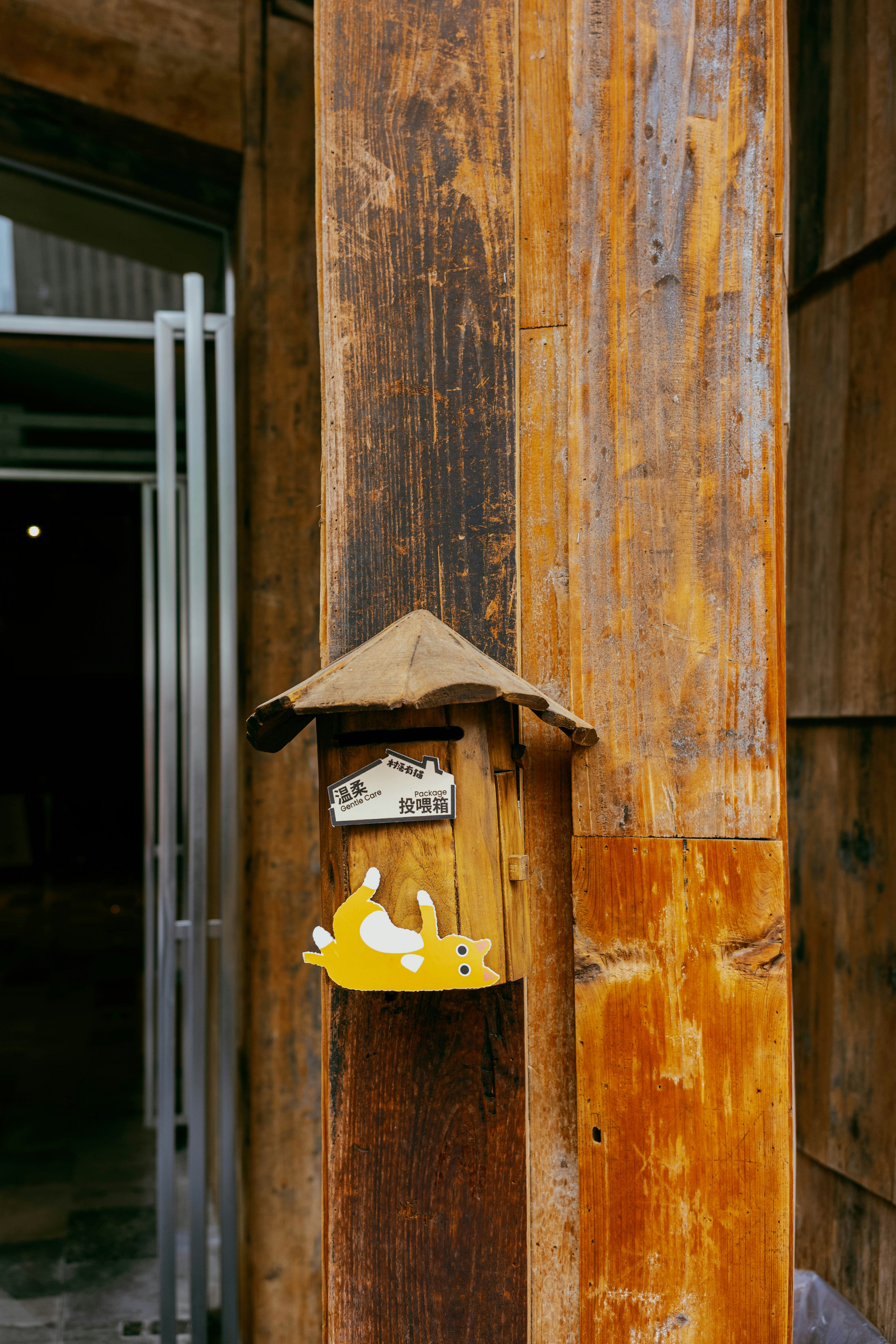 Sticky Note Surprise on a Weathered Timber Post