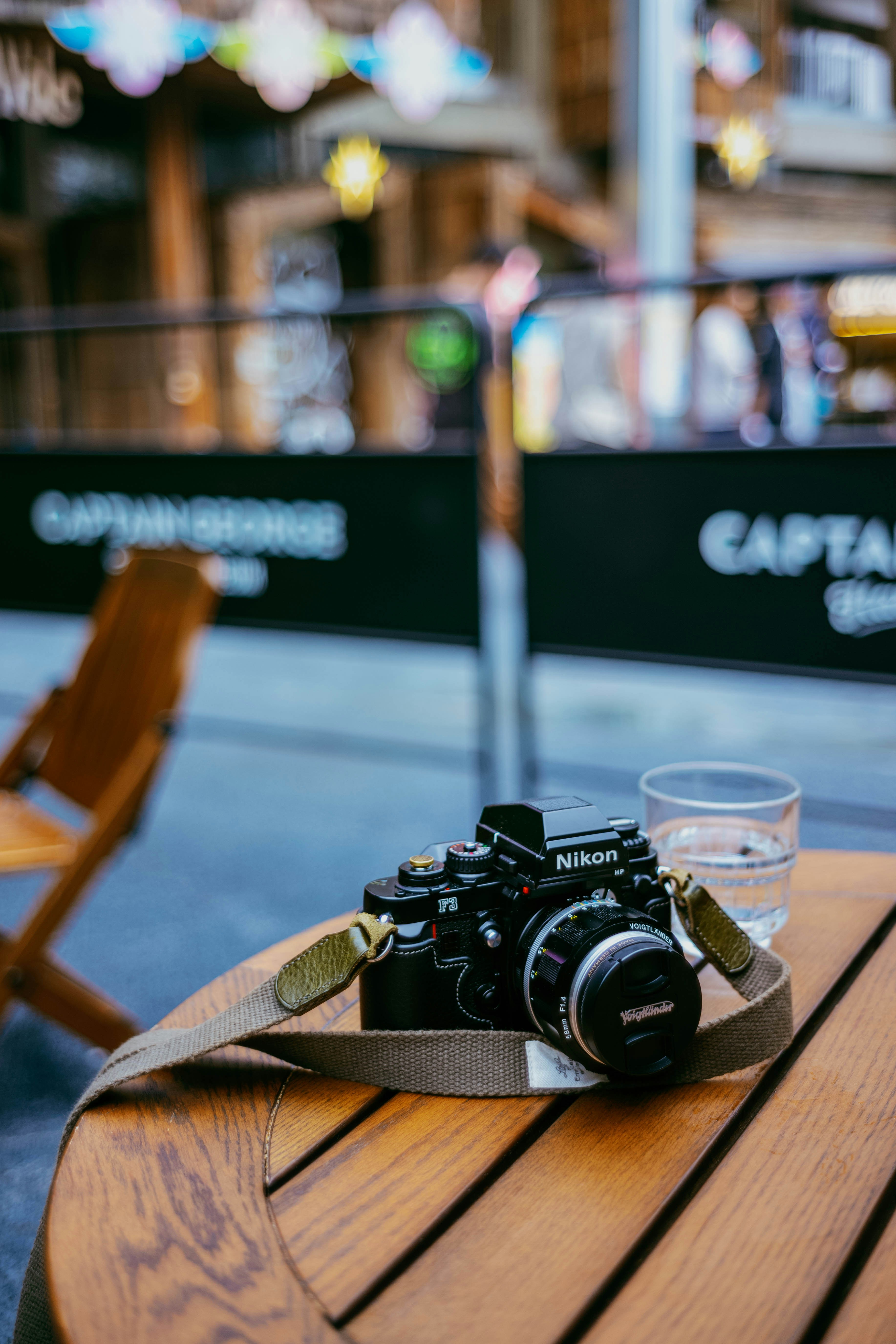 Nikon on the Table: A Quiet Moment at the Outdoor Café