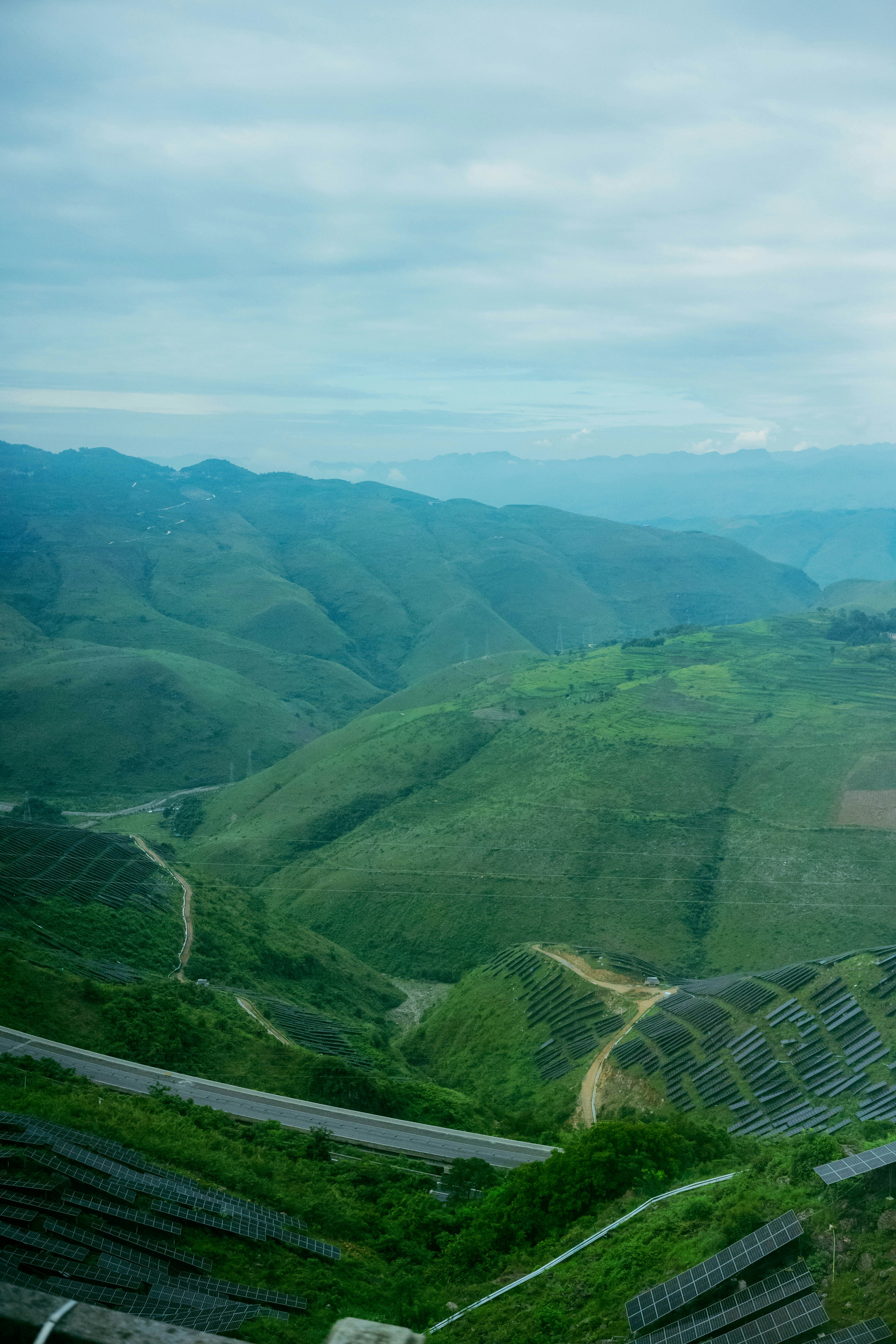 Terraced Valleys under a Veil of Clouds
