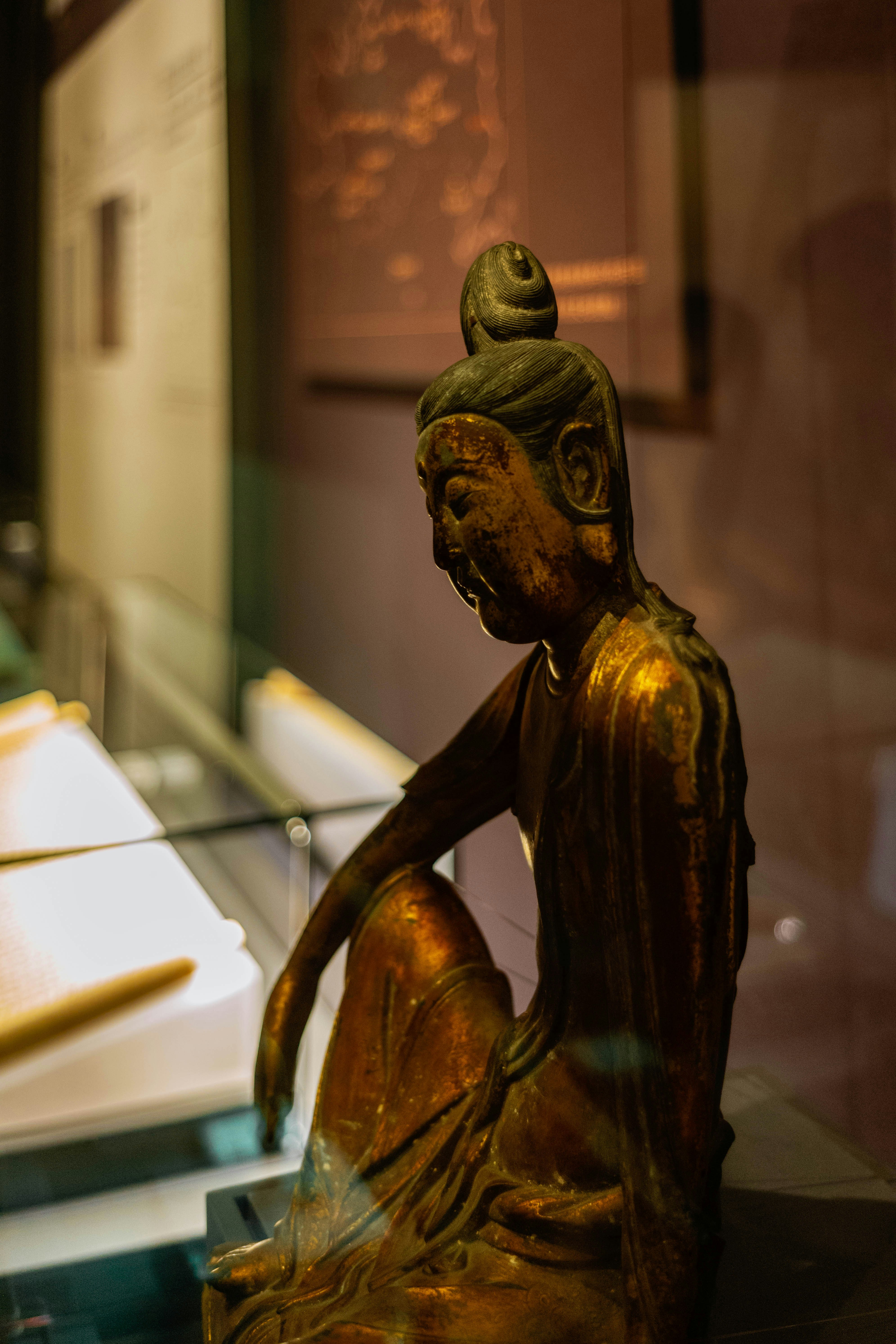 Bronze Buddha in a Quiet Museum Niche