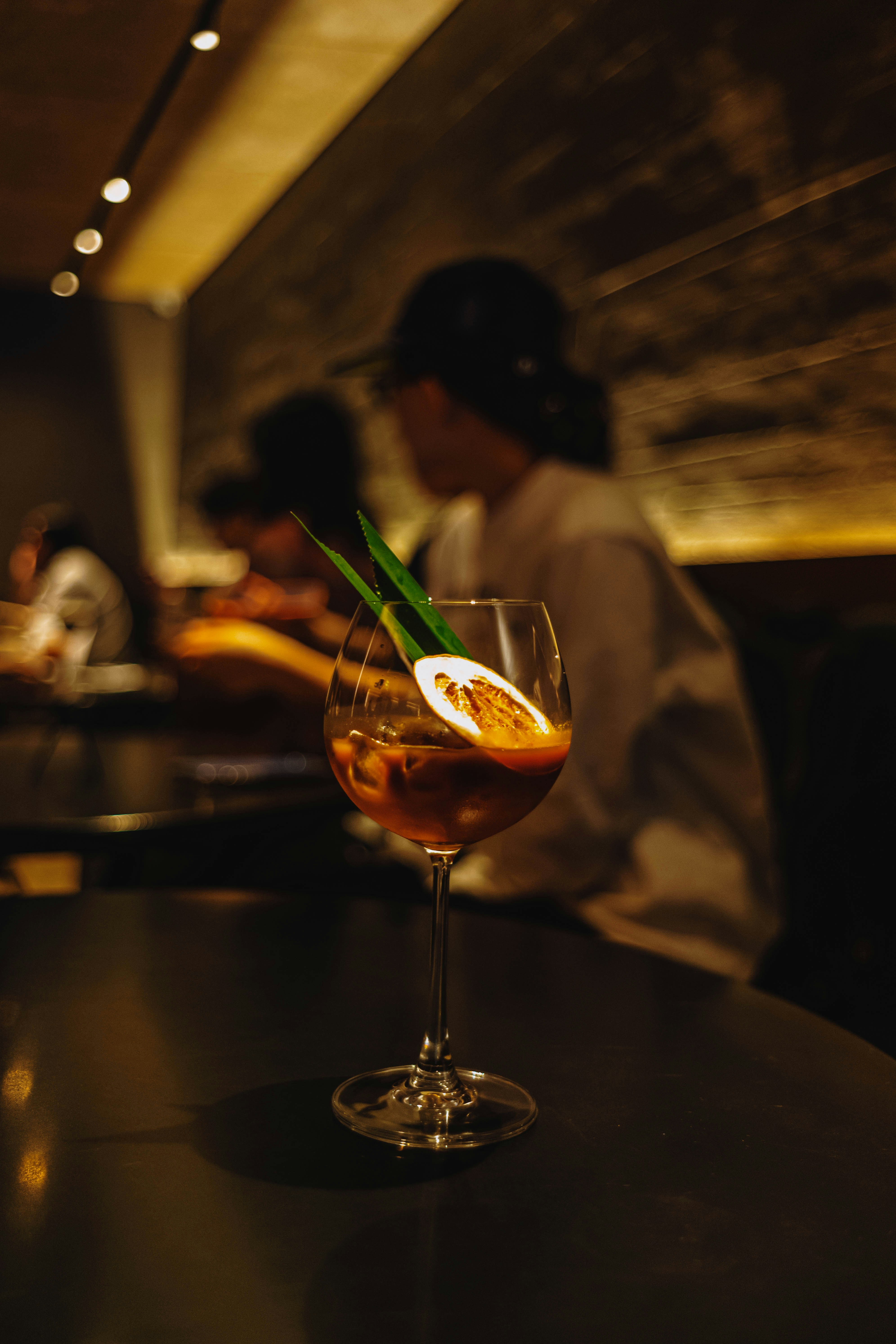 Amber Sip under Warm Club Lights