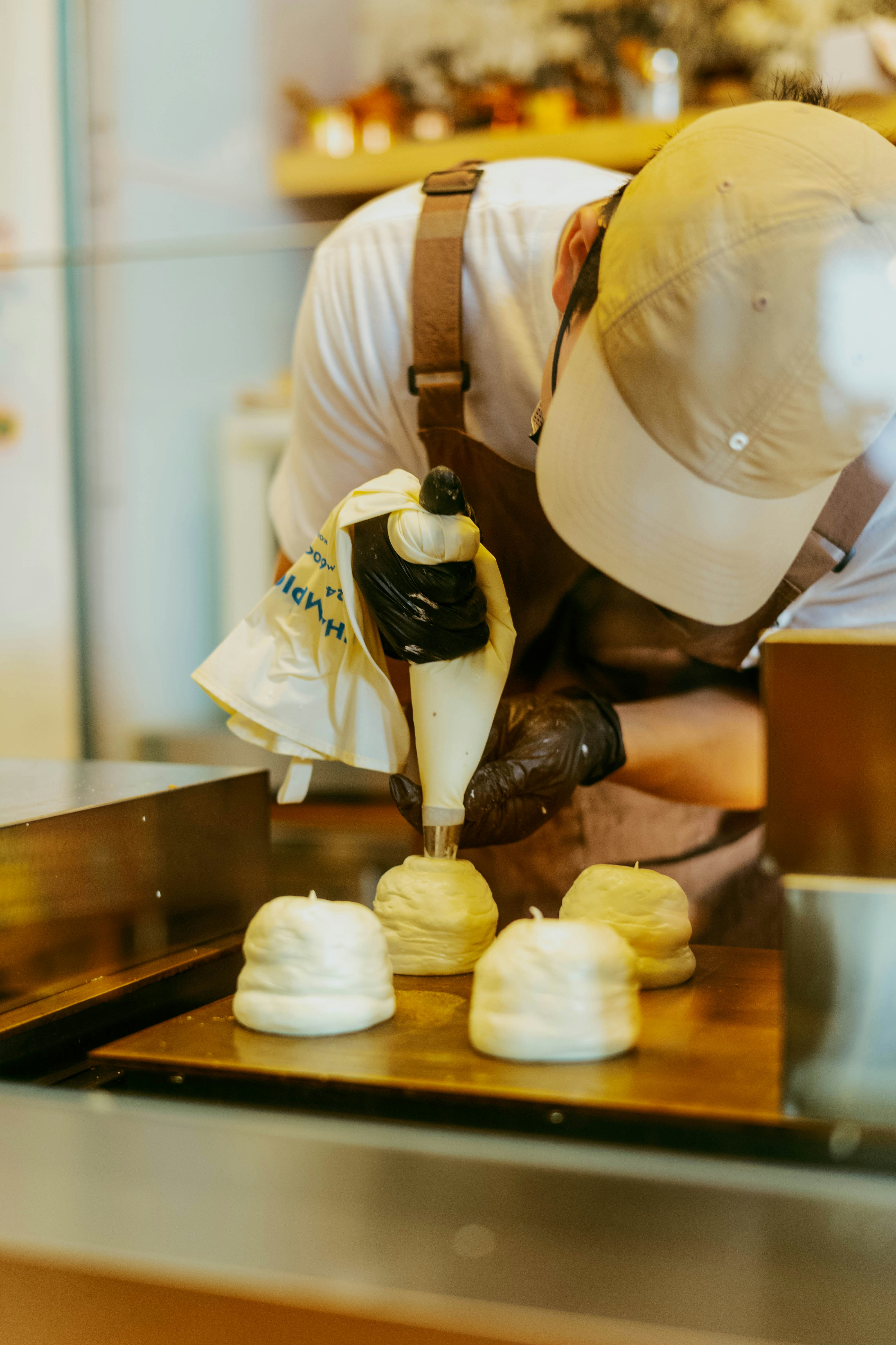 Cream Puffs in a Calibrated Cascade: A Pastry Chef Finishing with Precision