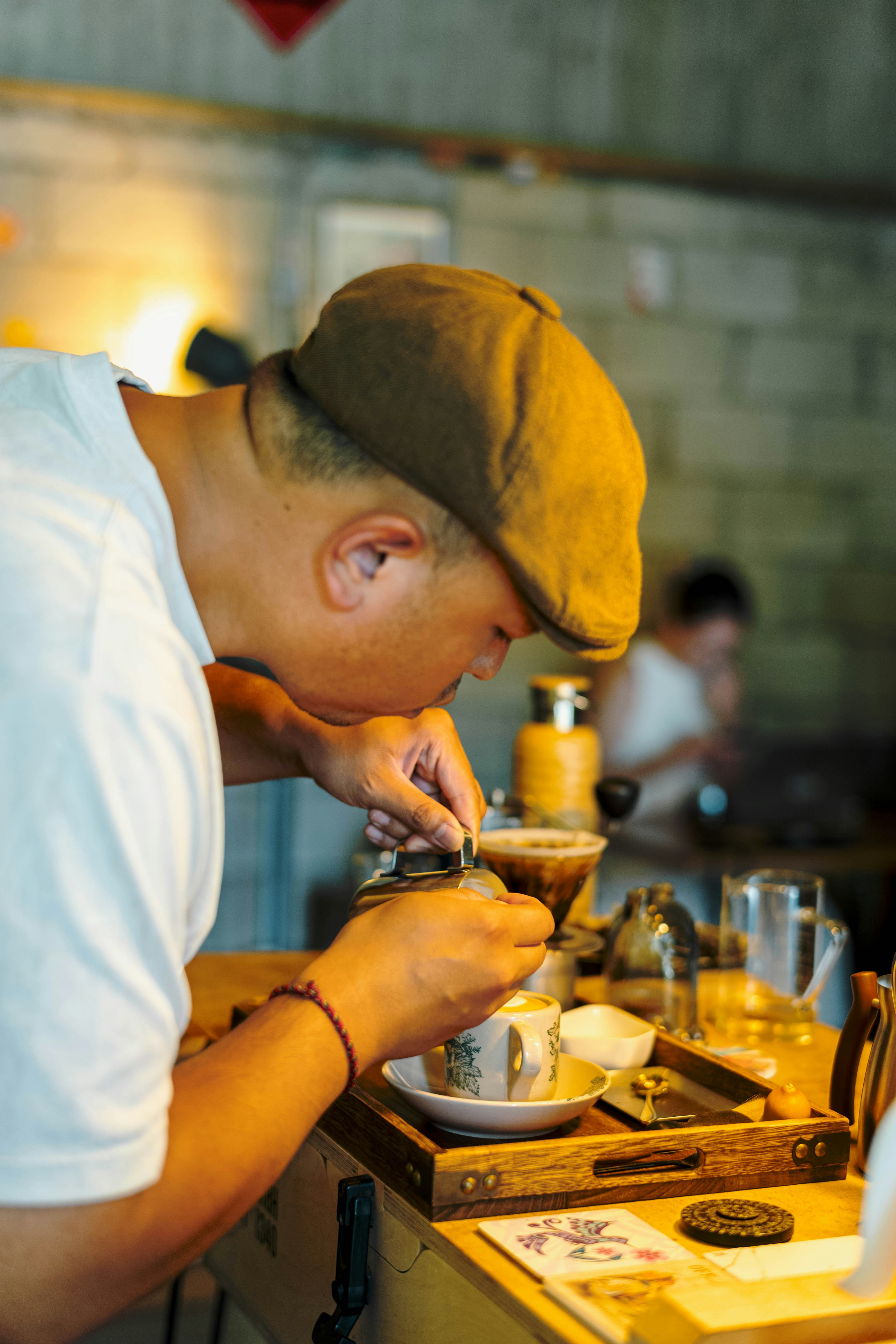 Craftsman at the Edge: Focused Hands in a Café Workspace
