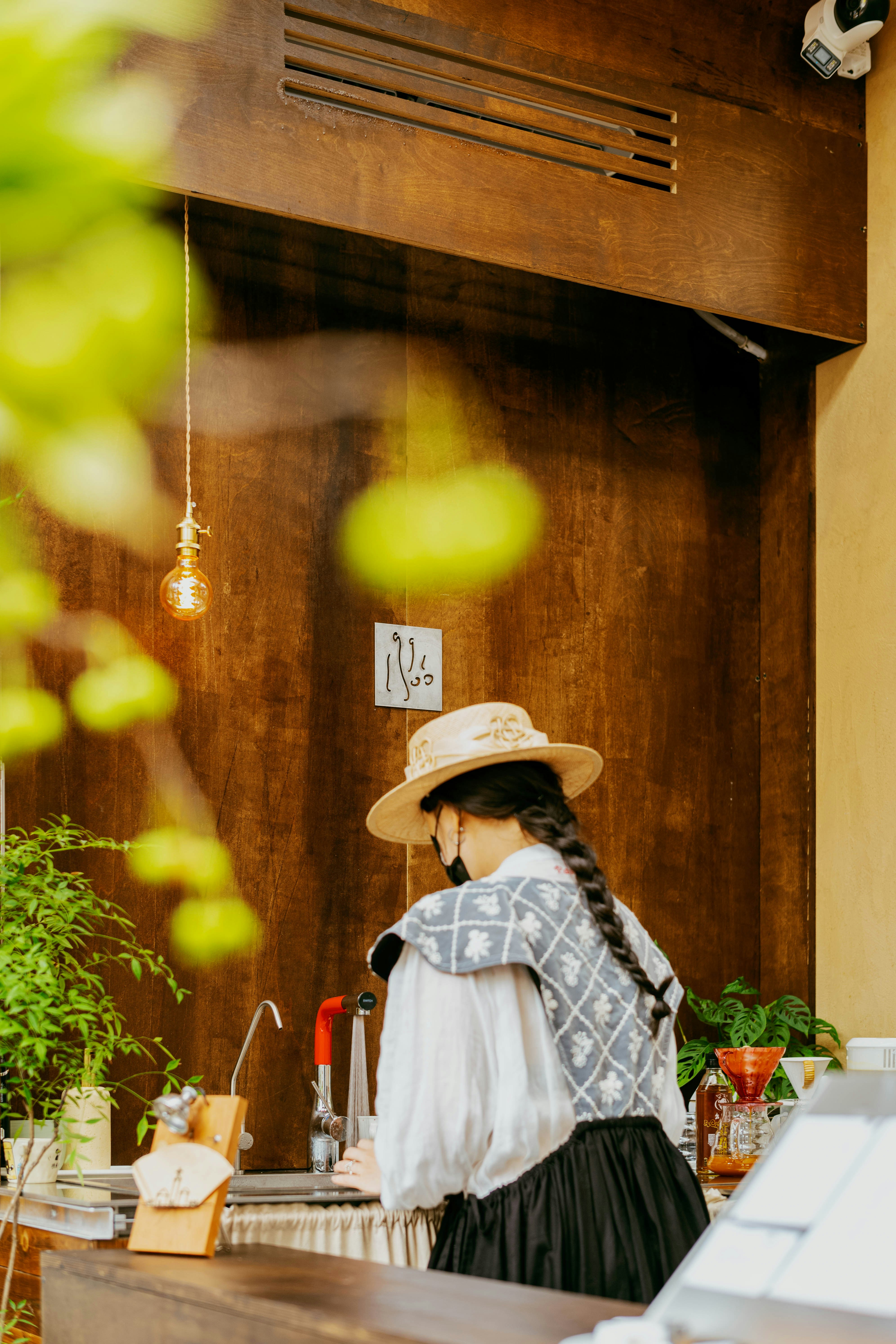Braided Quiet in a Sunlit Café Portrait