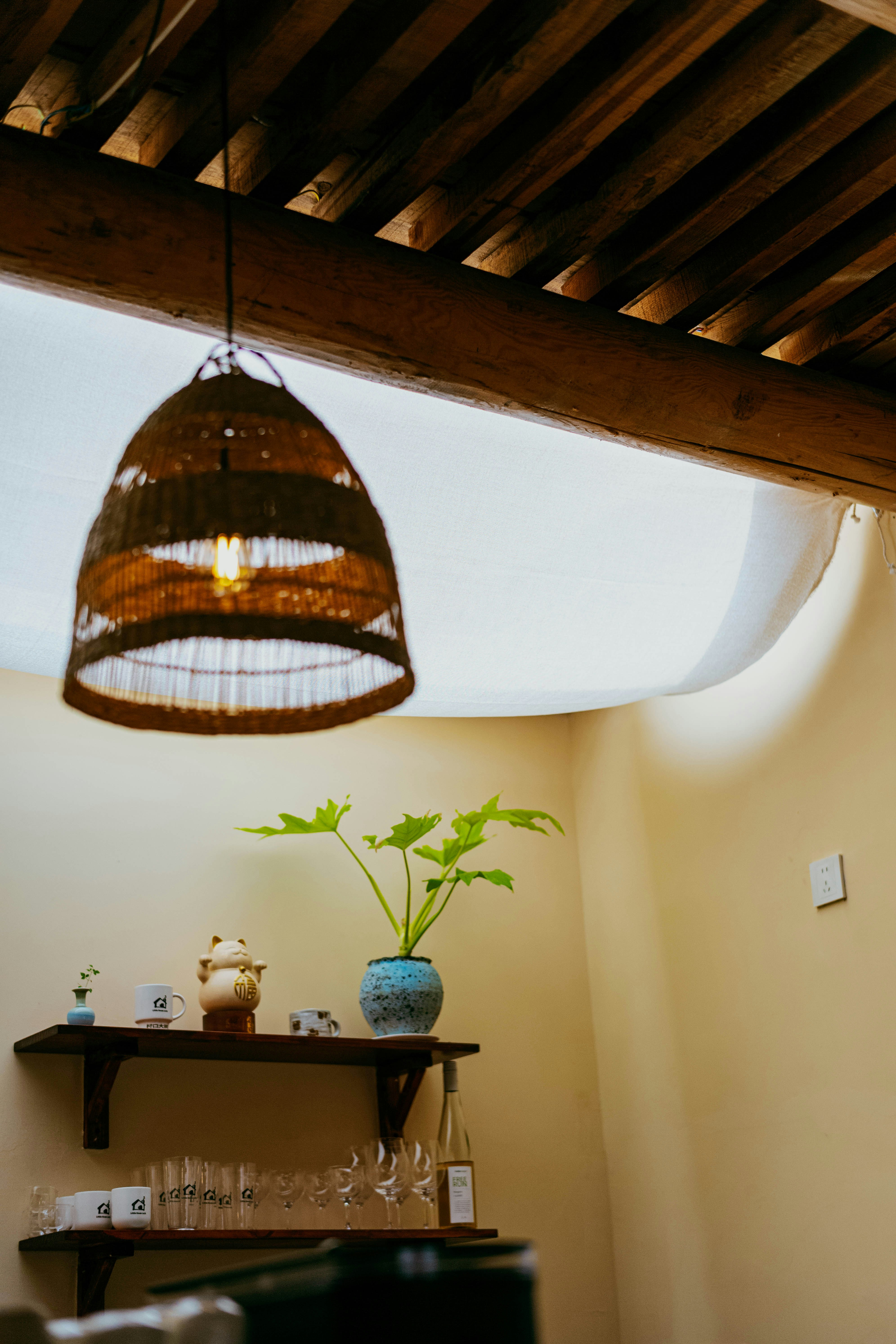 Warm Corner: A Hanging Lamp Over a Cozy Shelf Scene