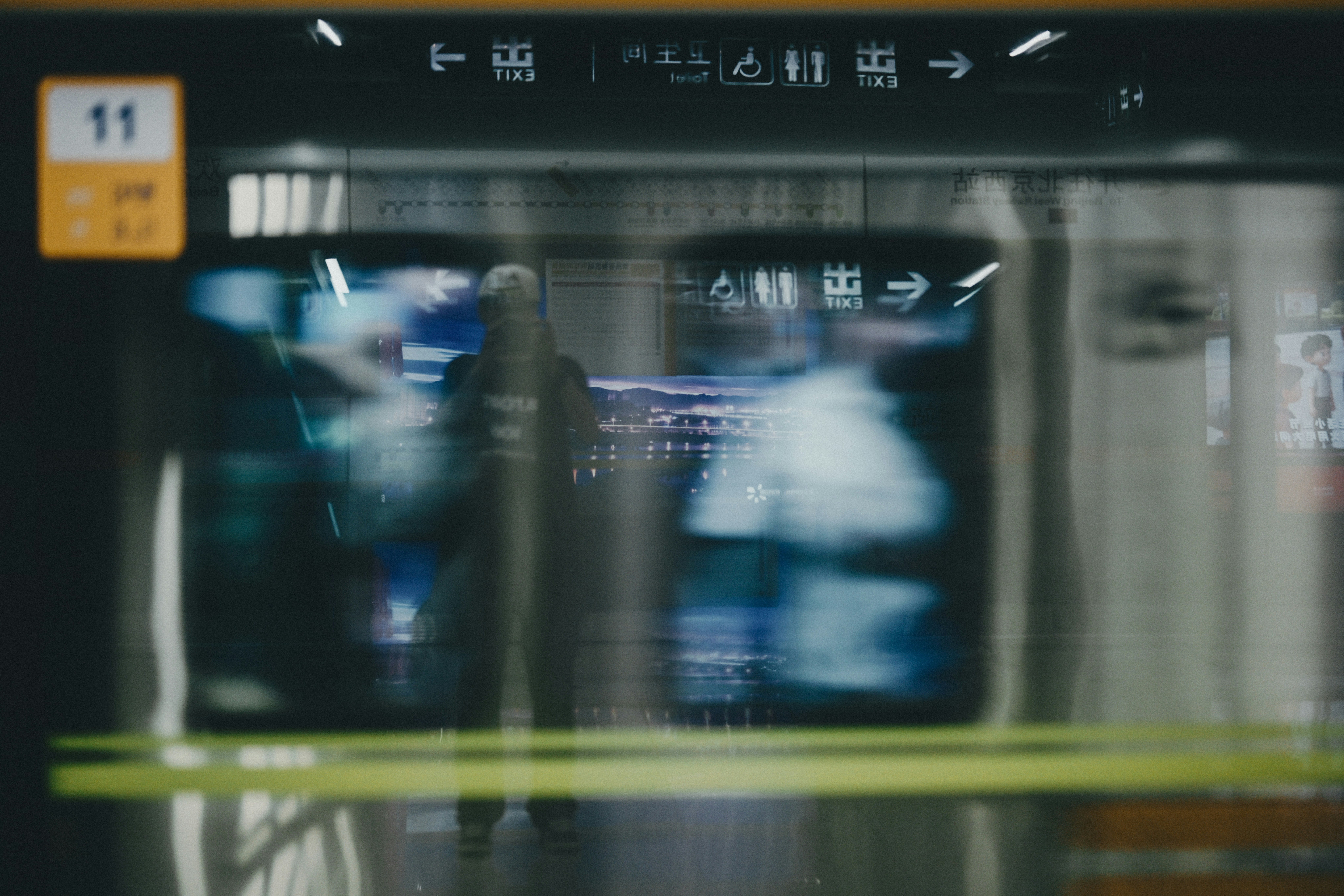 Ghosts in Transit: A Blur of Movement in a Subway Concourse