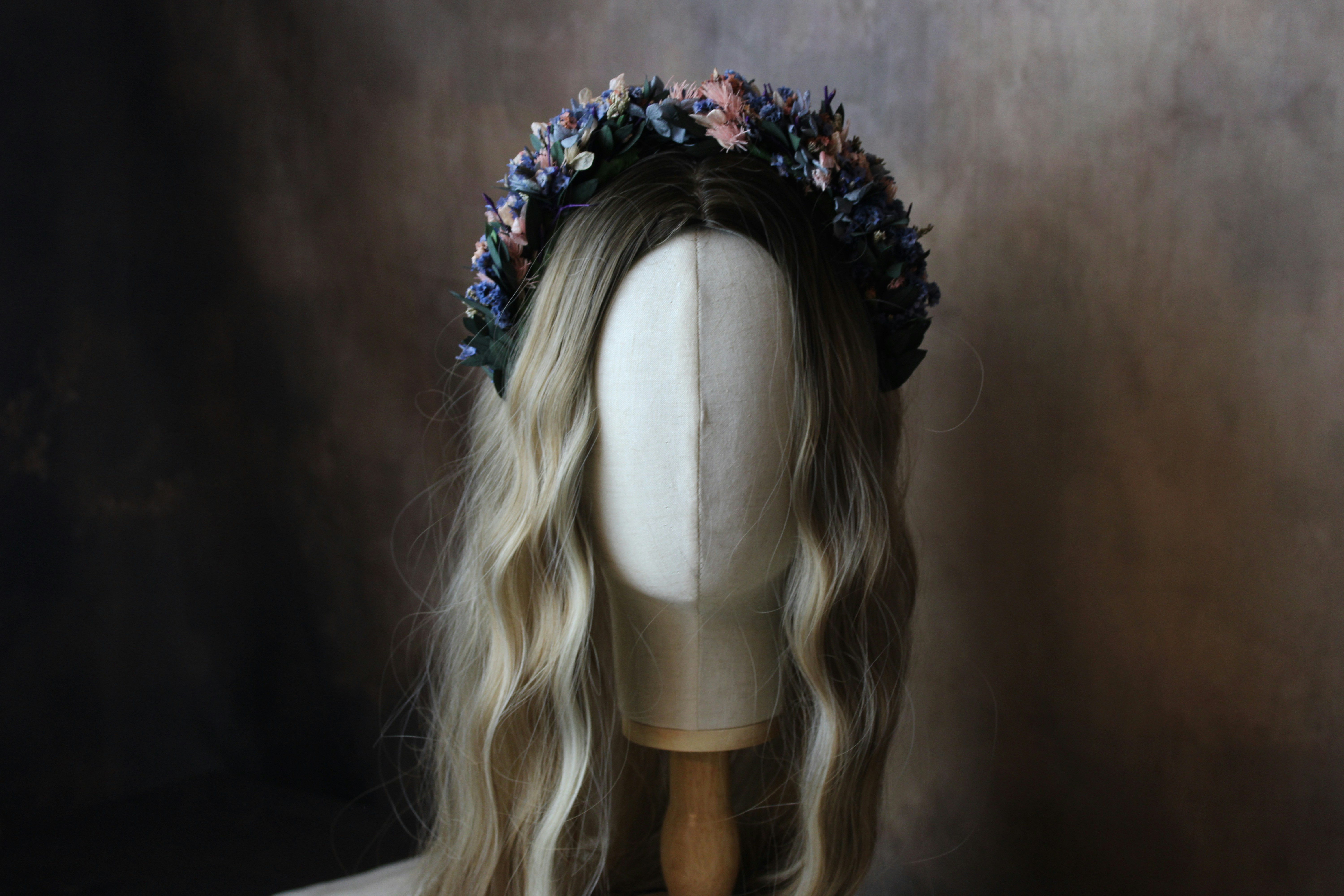 Floral Crown Silhouette: A Faceless Muse on Velvet