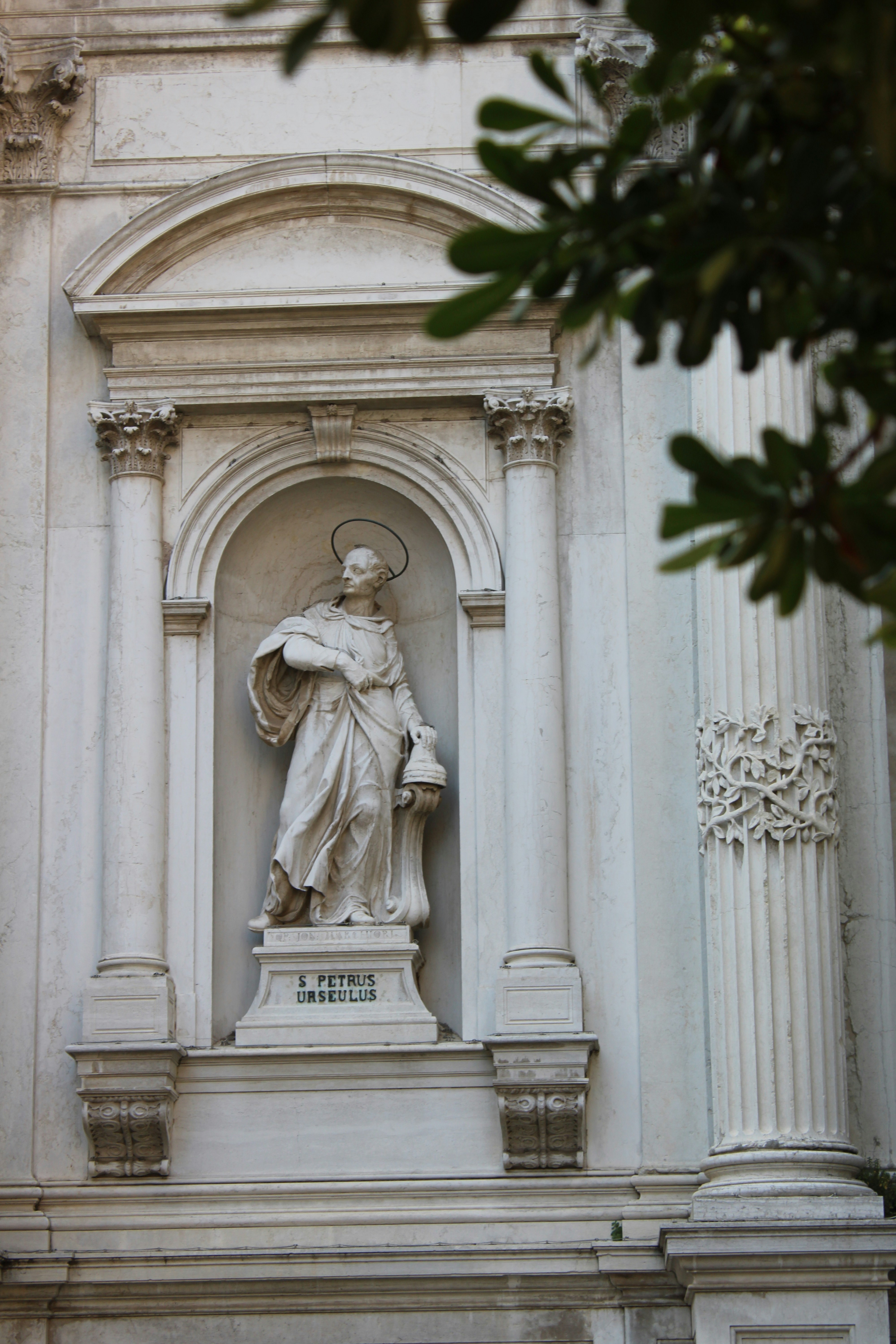 Saintly Gesture in Marble Niche